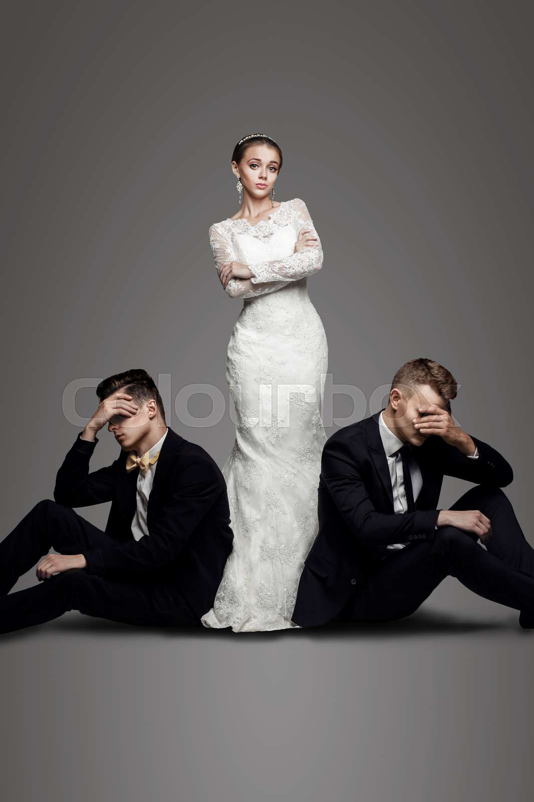 Two handsome men and beautiful bride, studio | Stock image | Colourbox