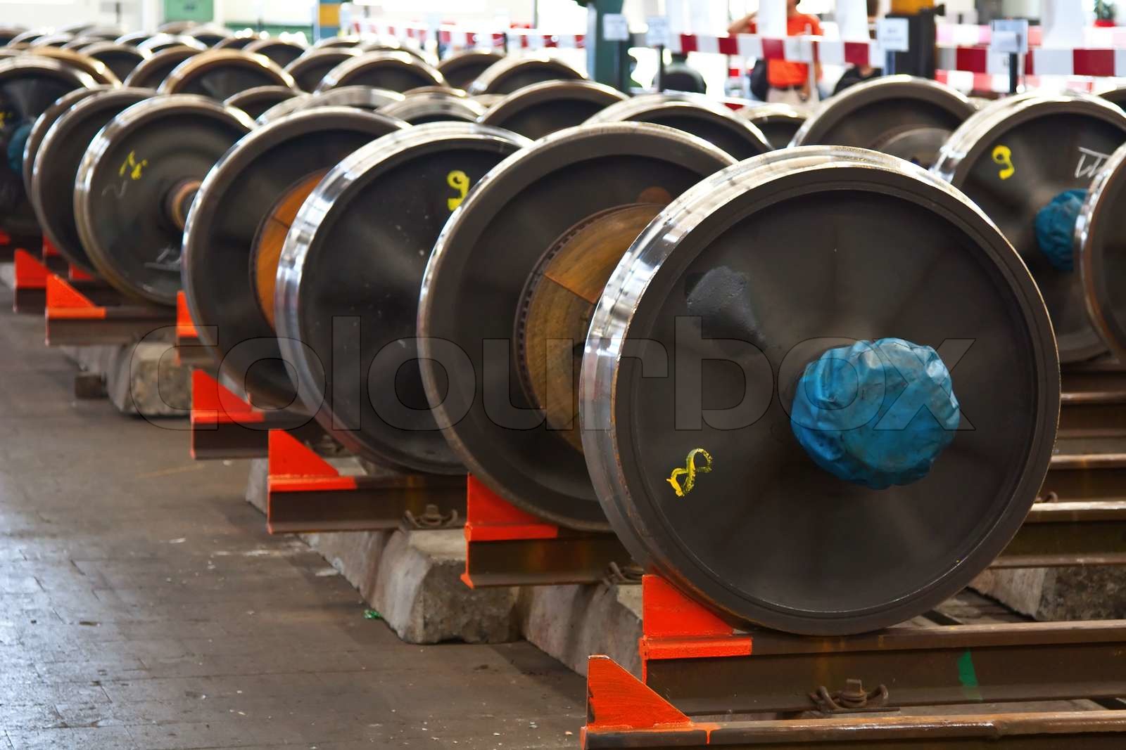 Spare railway wheels on the axle in a repair workshop | Stock image ...