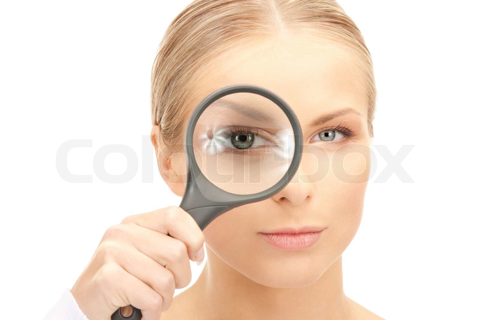 Bild der Frau mit Lupe über weiße | Stock Bild | Colourbox