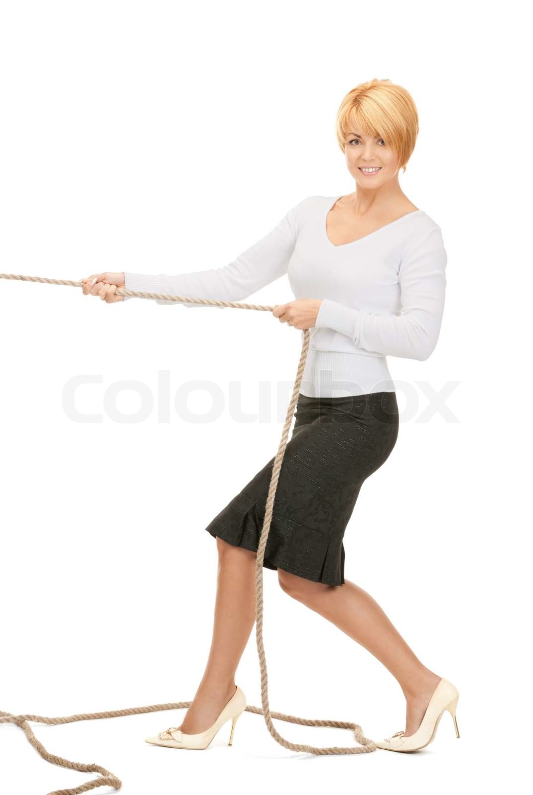 bright picture of business woman pulling rope | Stock image | Colourbox