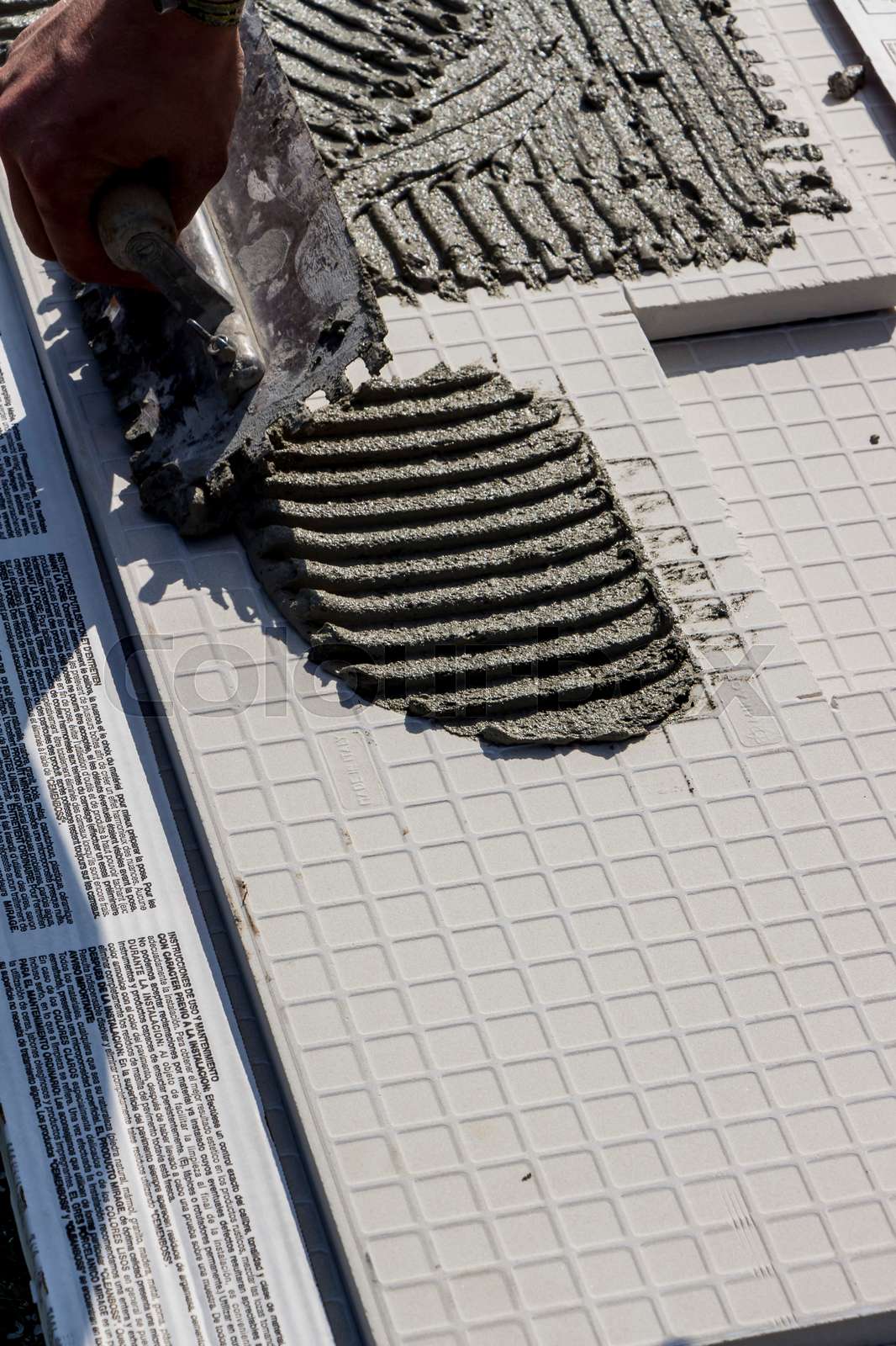 putty a tile layer | Stock image | Colourbox