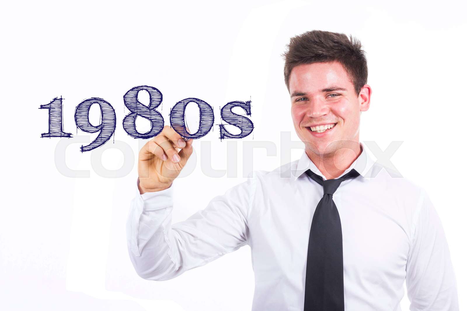 1980s - Young smiling businessman writing on transparent surface ...