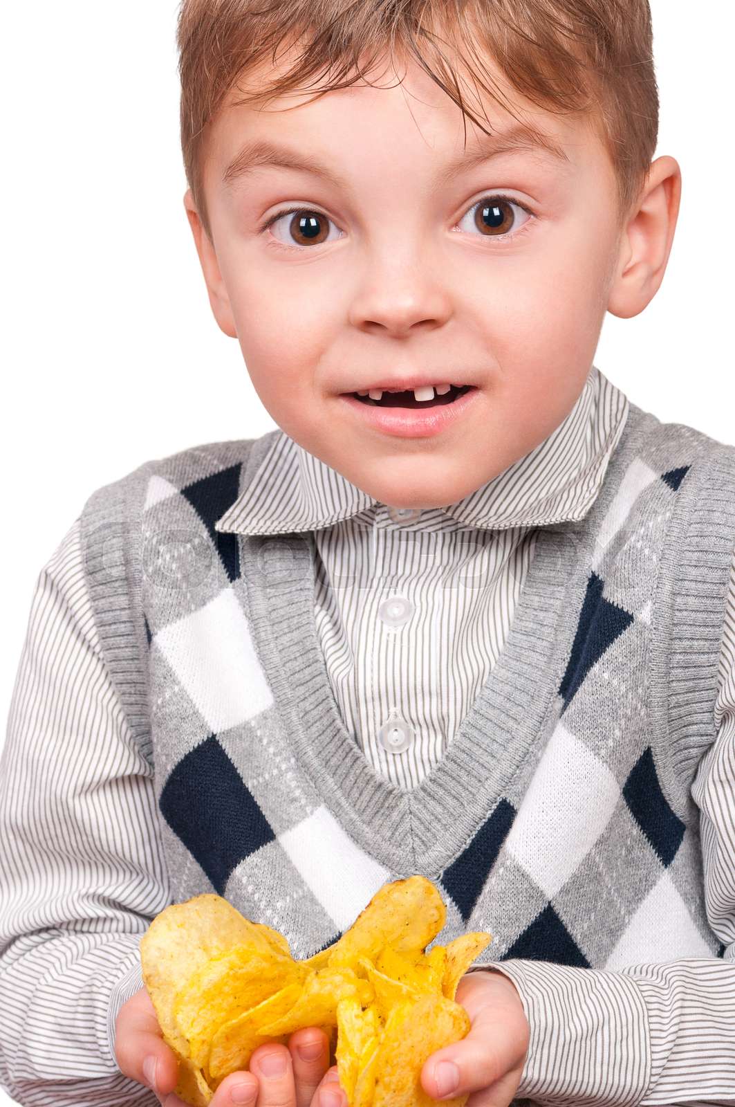 Little boy with packet potato chips | Stock image | Colourbox