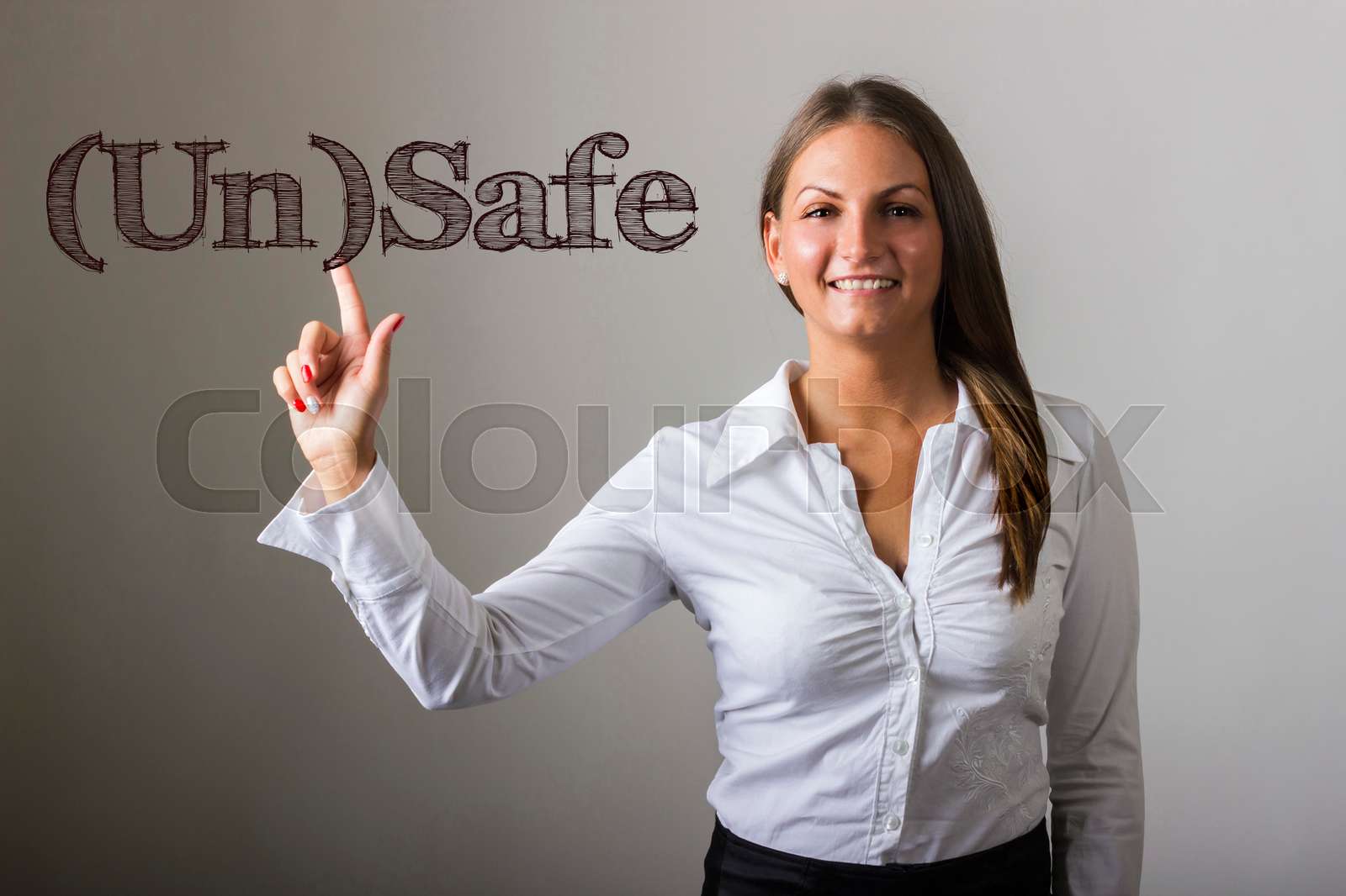 (Un)Safe - Beautiful girl touching text on transparent surface | Stock ...
