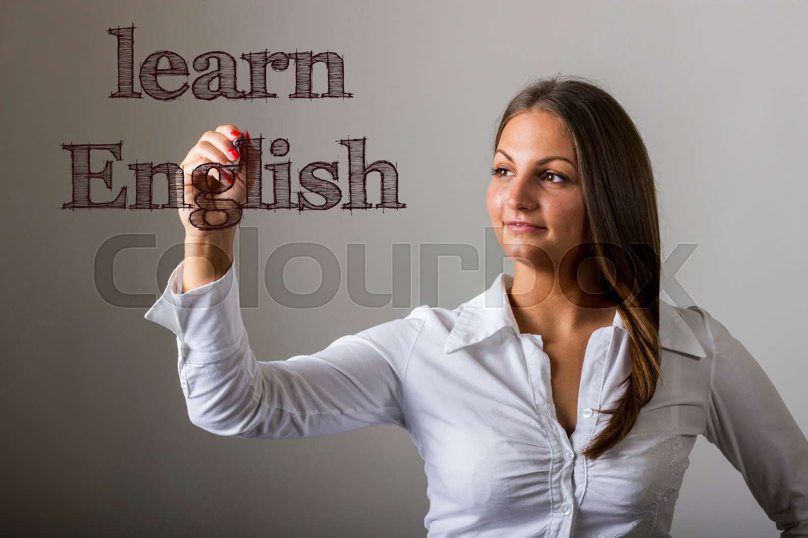 Learn English - Beautiful girl writing on transparent surface | Stock ...