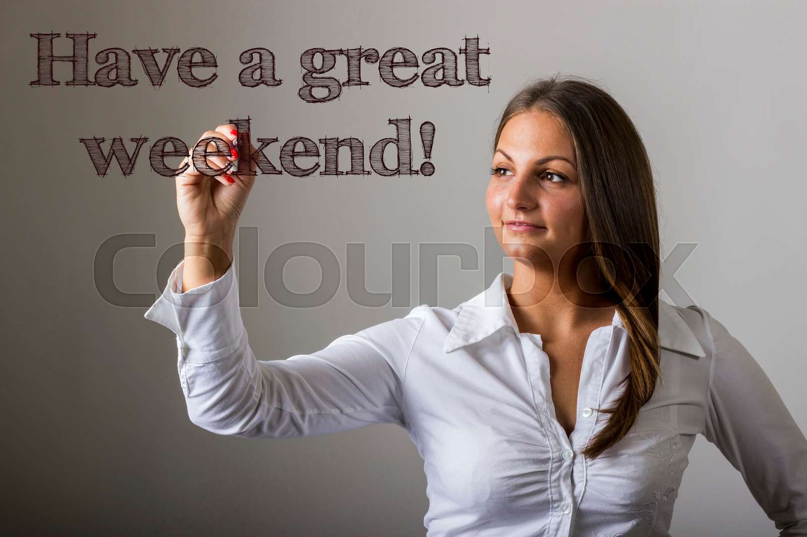 Have a great weekend! - Beautiful girl writing on transparent surface ...