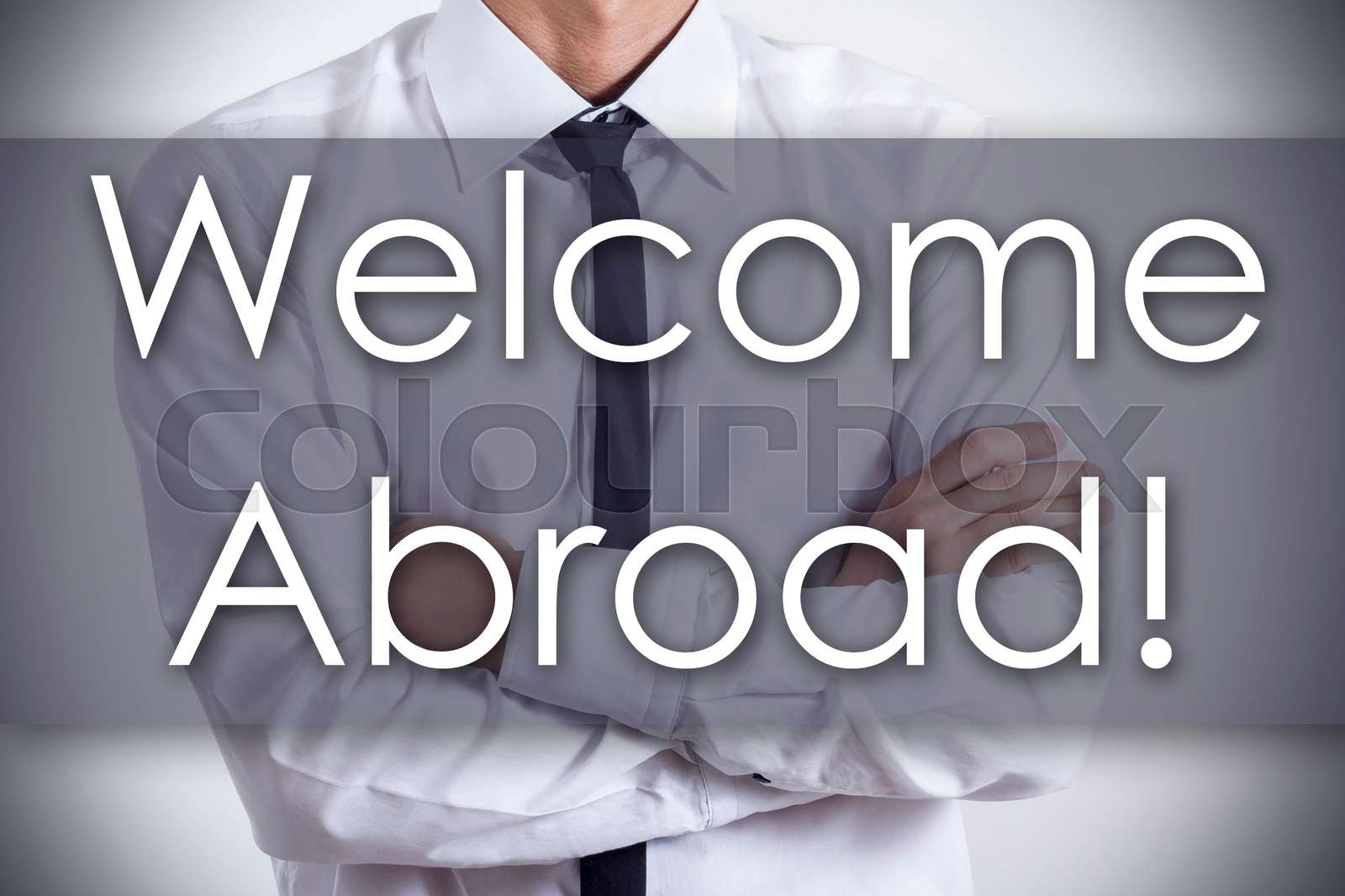 Welcome Abroad! - Young businessman with text - business concept ...