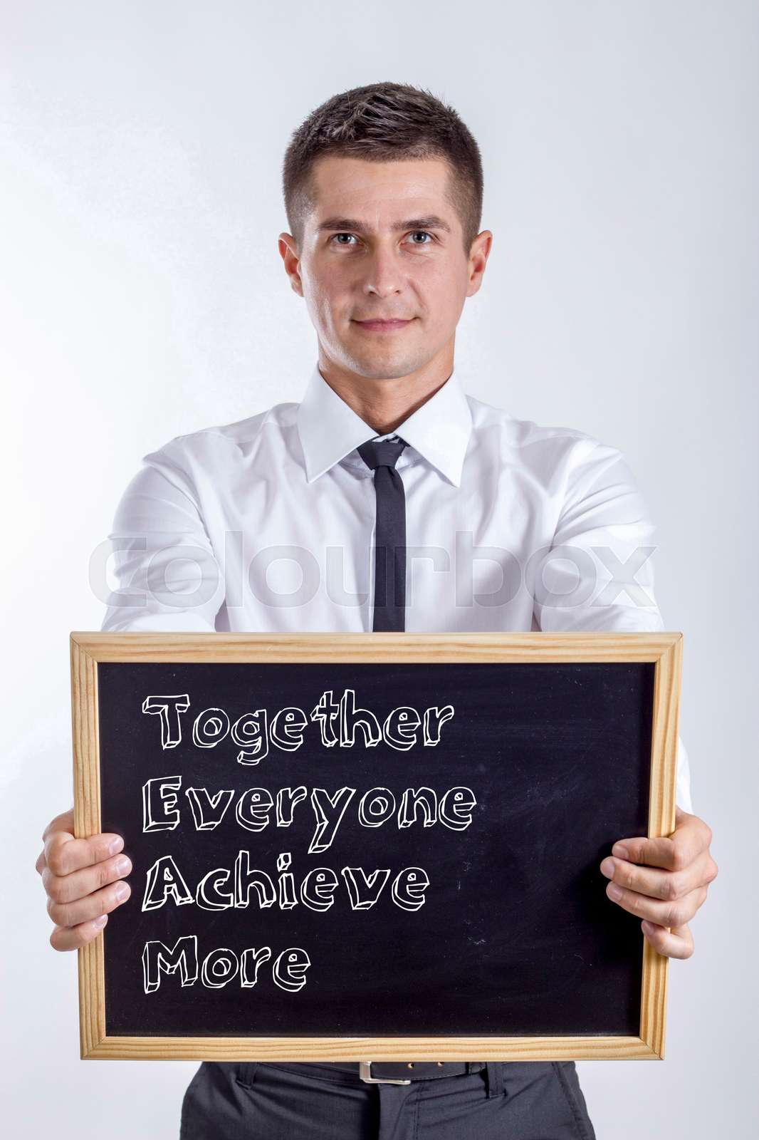 Together Everyone Achieve More TEAM - Young businessman holding ... Together Everyone Achieve More TEAM - Young businessman holding ...