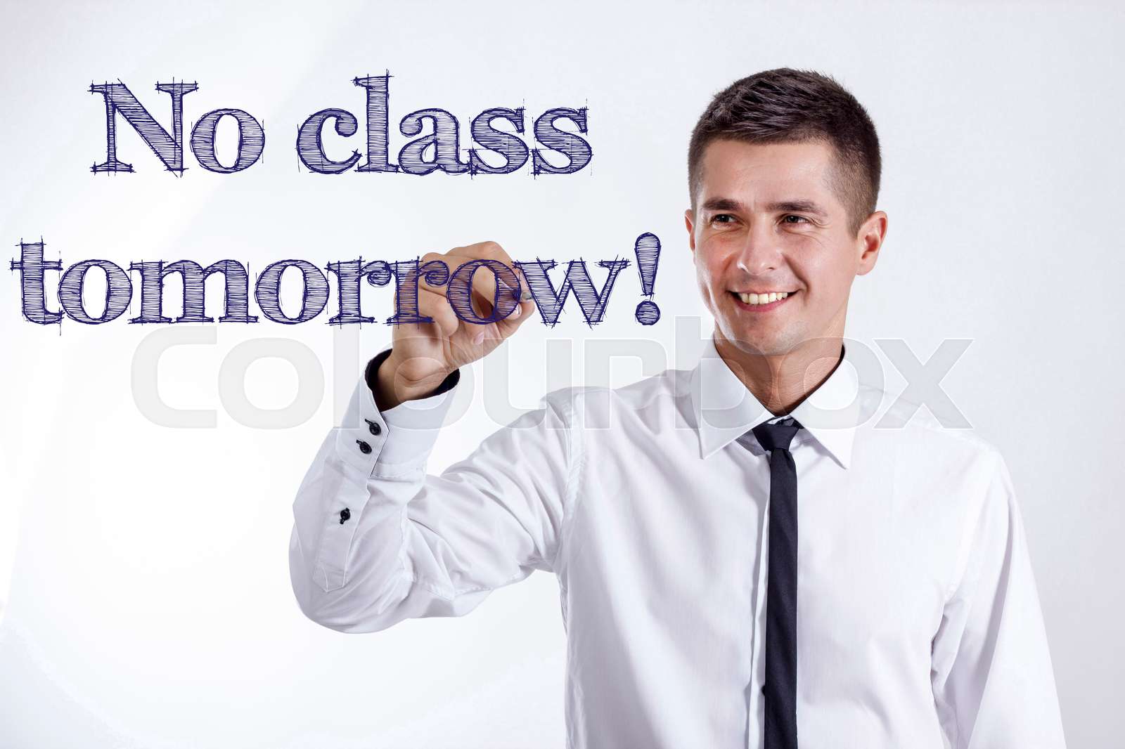 No class tomorrow! - Young smiling businessman writing on transparent ...