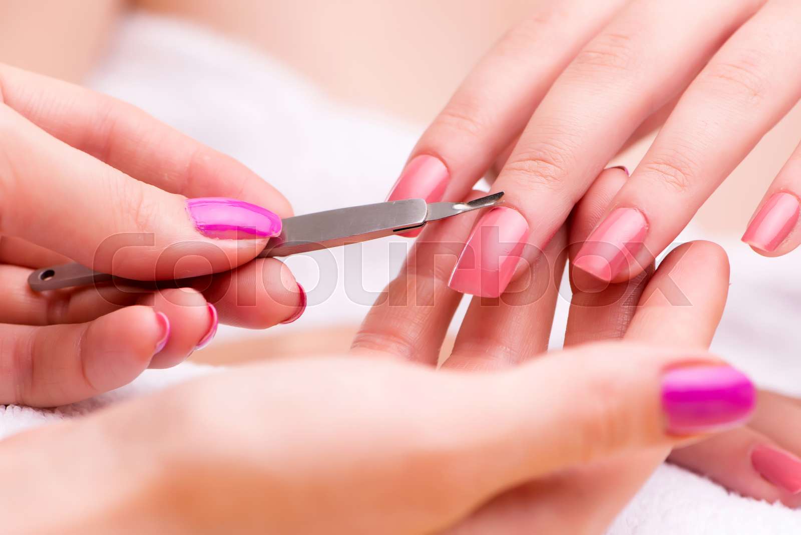 Woman hands during manicure session | Stock image | Colourbox