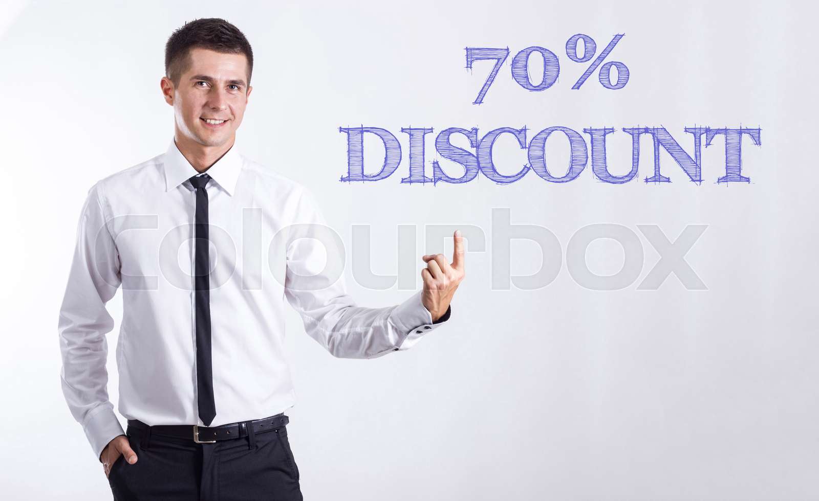 70% DISCOUNT - Young smiling businessman pointing on text | Stock image ...