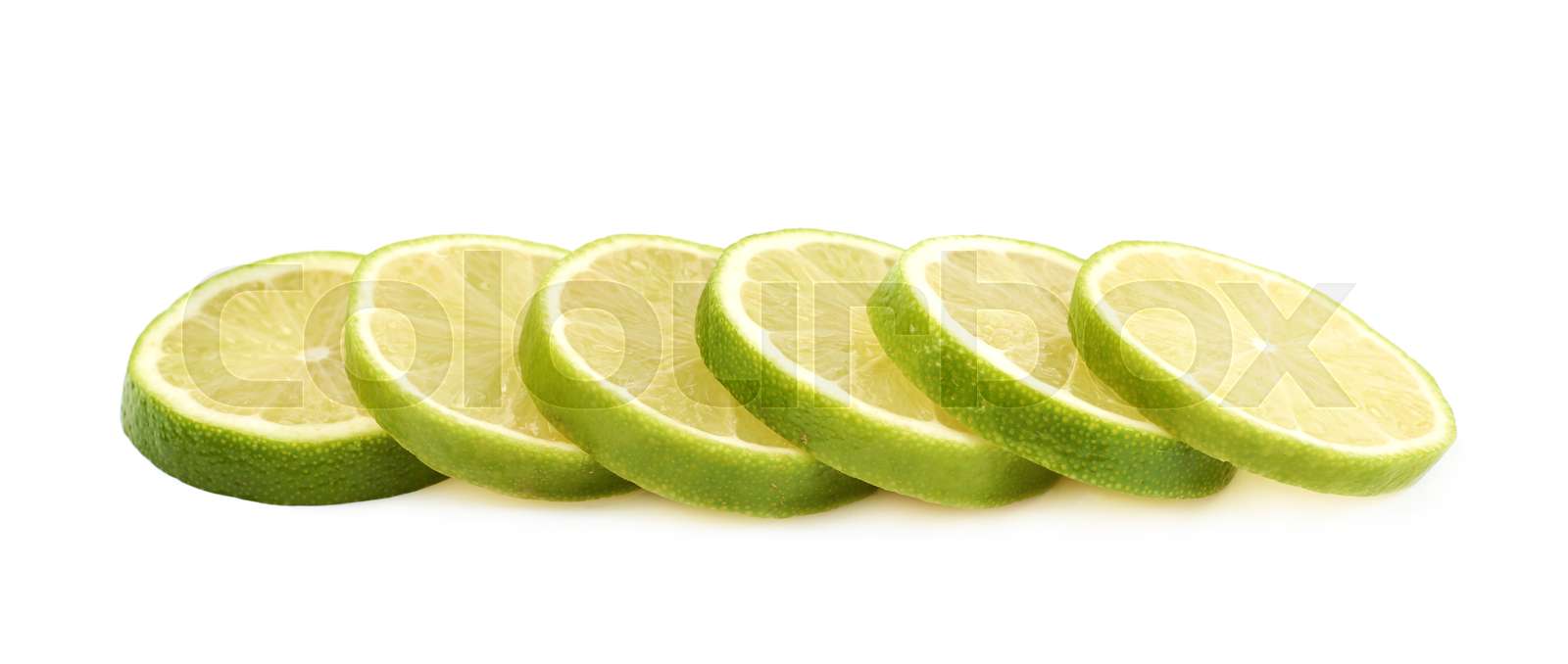 Pile of multiple lime slices isolated | Stock image | Colourbox