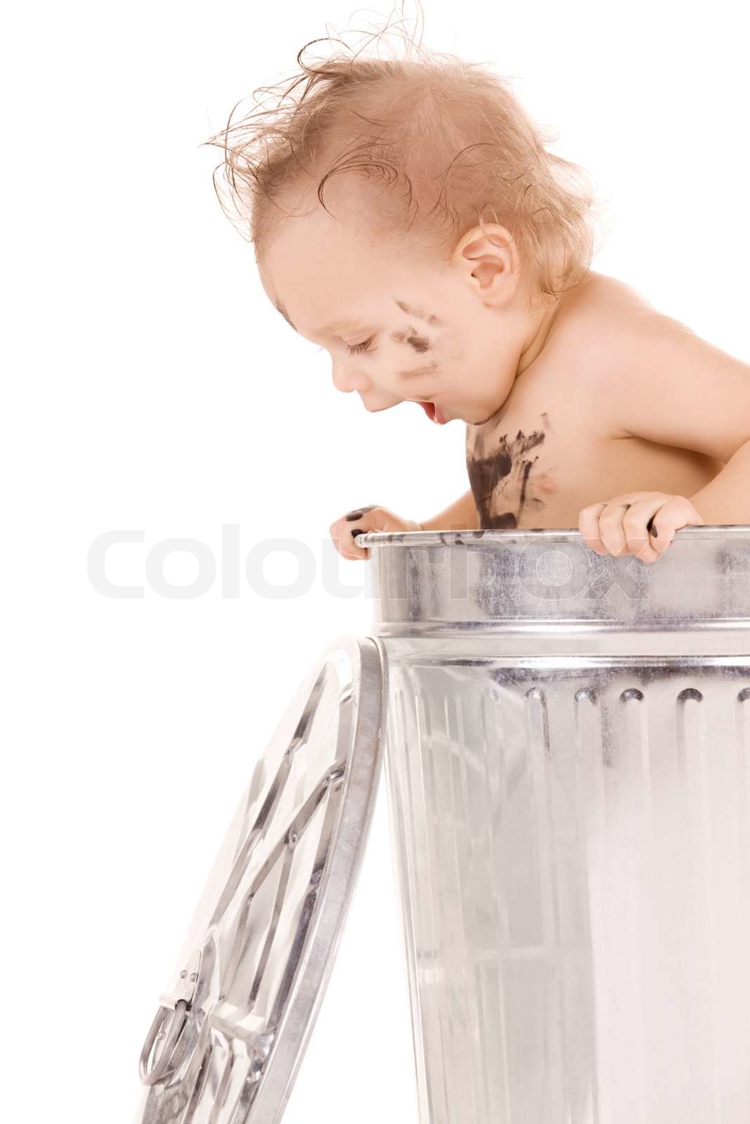 picture of adorable baby in trash can | Stock image | Colourbox