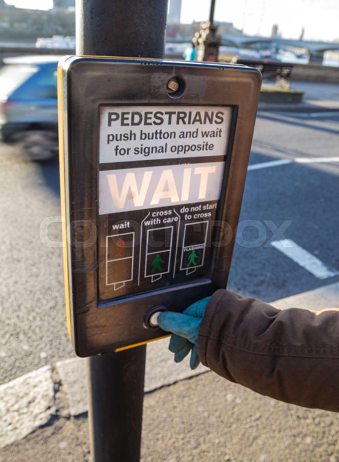 Wait plate is operated at a traffic light | Stock image | Colourbox
