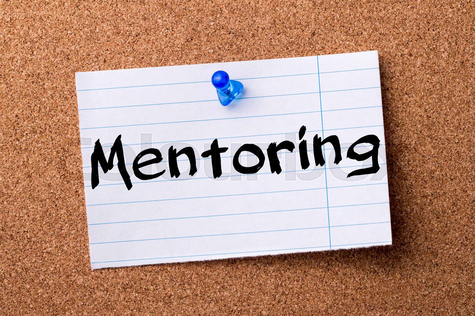 Mentoring - teared note paper pinned on bulletin board | Stock image | Colourbox