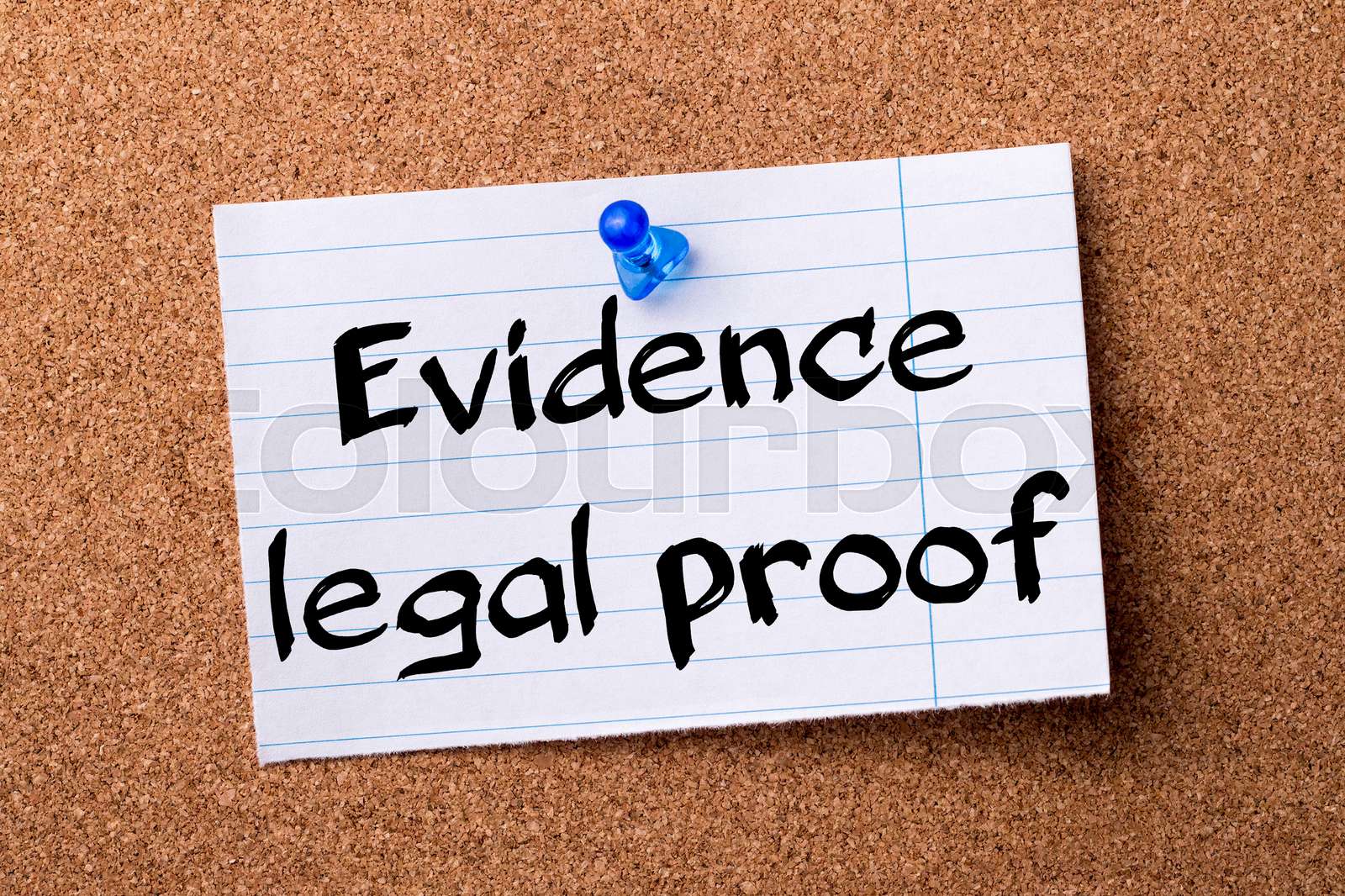 Evidence legal proof - teared note paper pinned on bulletin board ...
