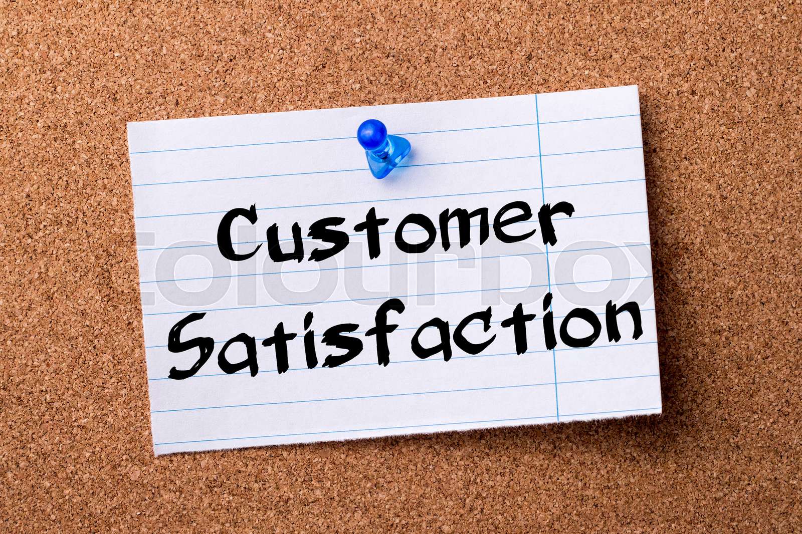 Customer Satisfaction - teared note paper pinned on bulletin board ...