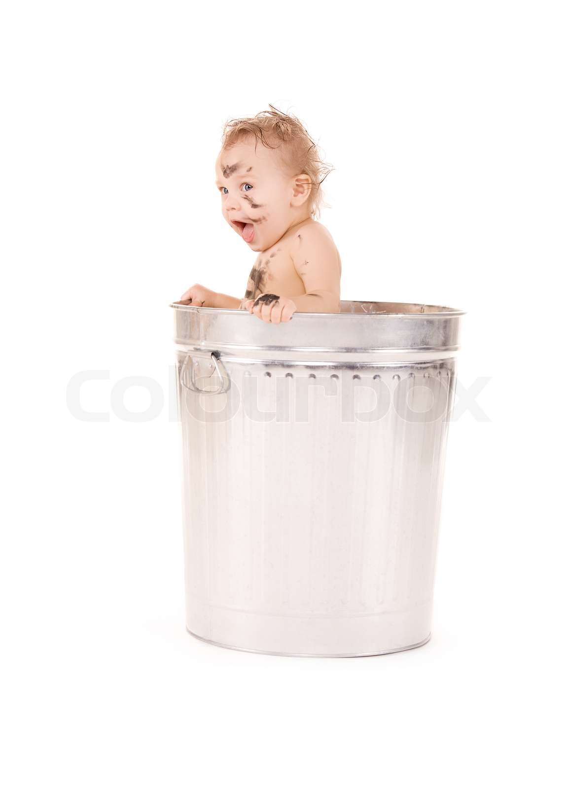 picture of adorable baby in trash can | Stock image | Colourbox