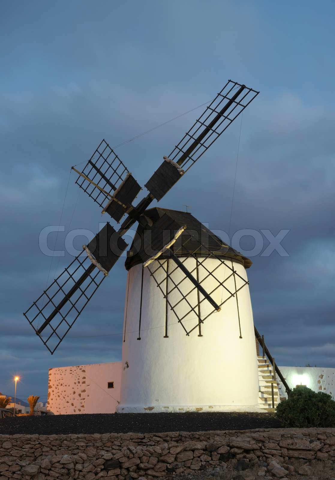 Traditional windmill illuminated at night | Stock image | Colourbox