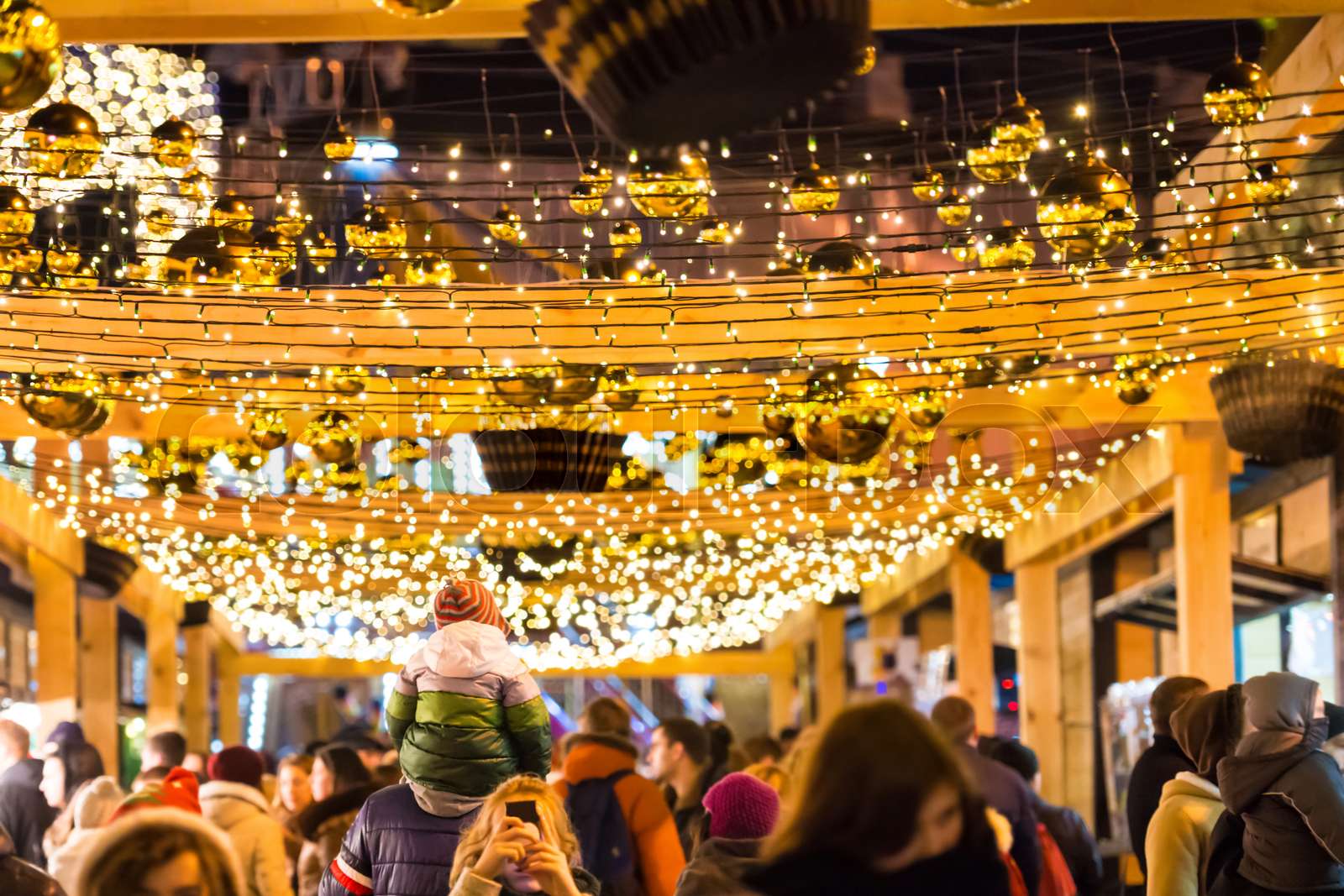 Crowd with children on street at night | Stock image | Colourbox