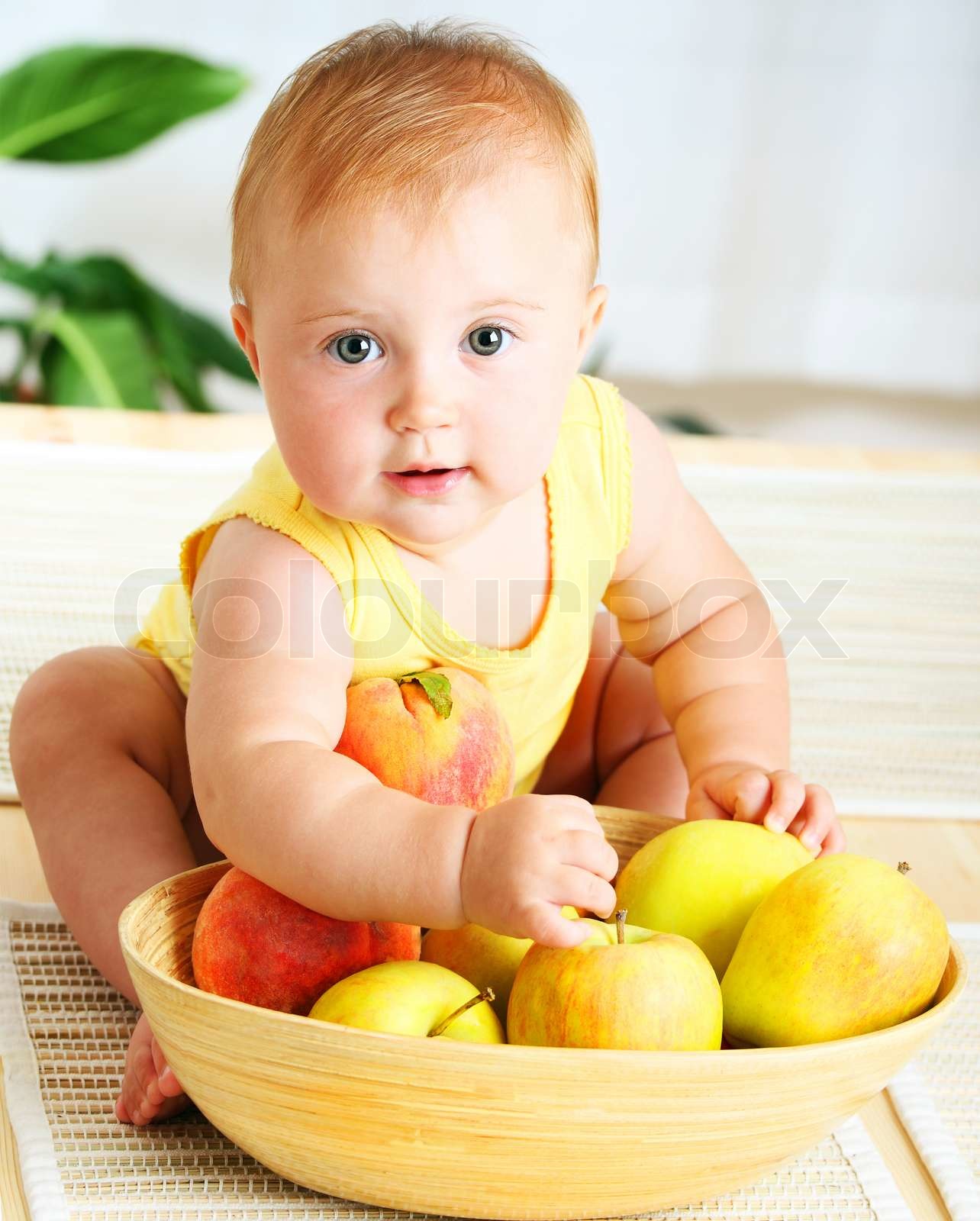 Little baby choosing fruits, closeup portrait, concept of health care ...
