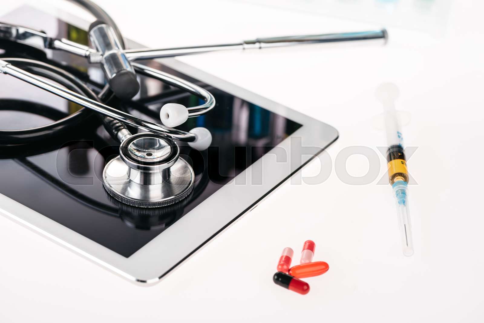 medical equipment on tablet, insulin syringe and pills on white | Stock ...