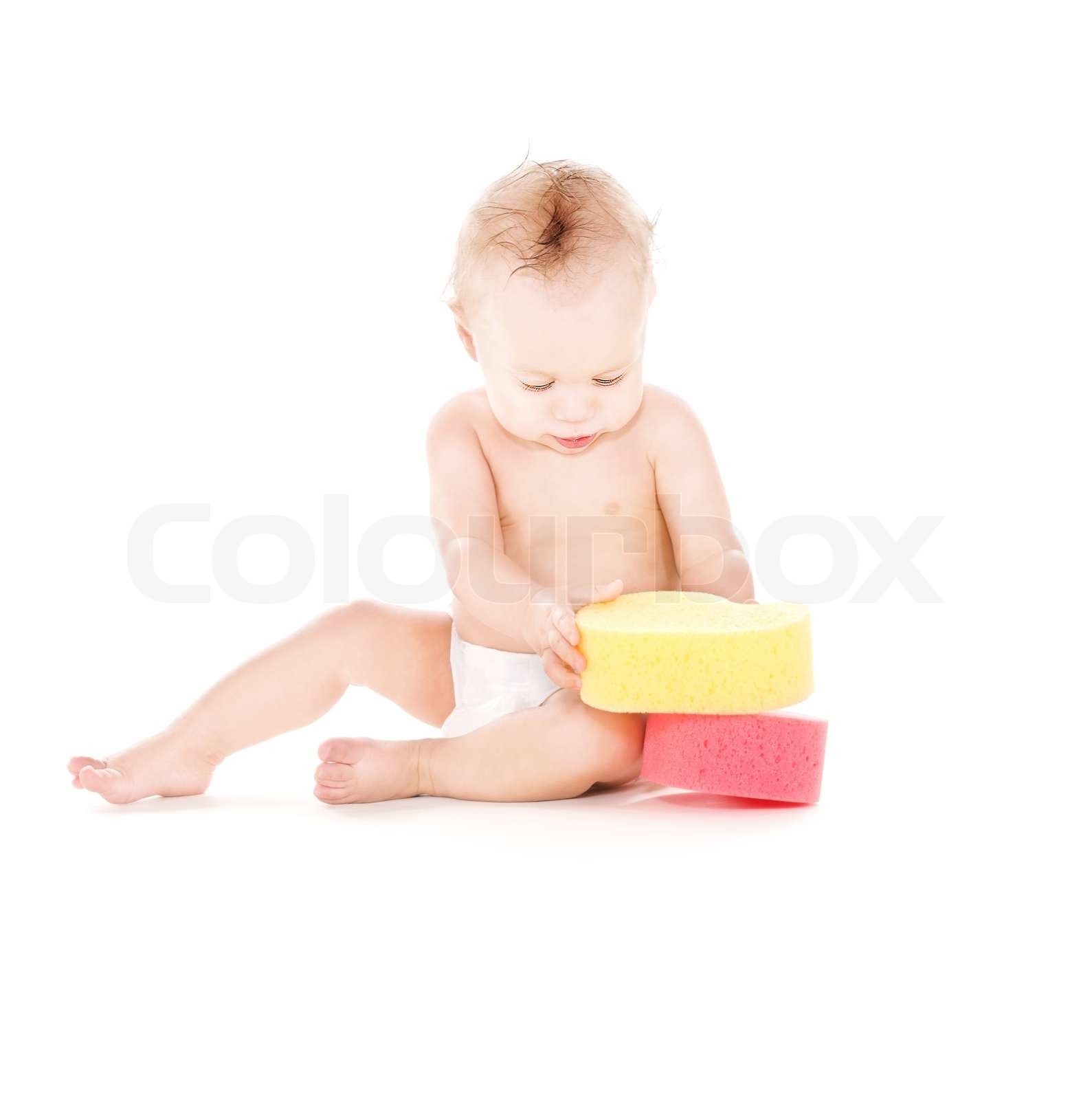 picture of baby boy with sponges over white | Stock image | Colourbox