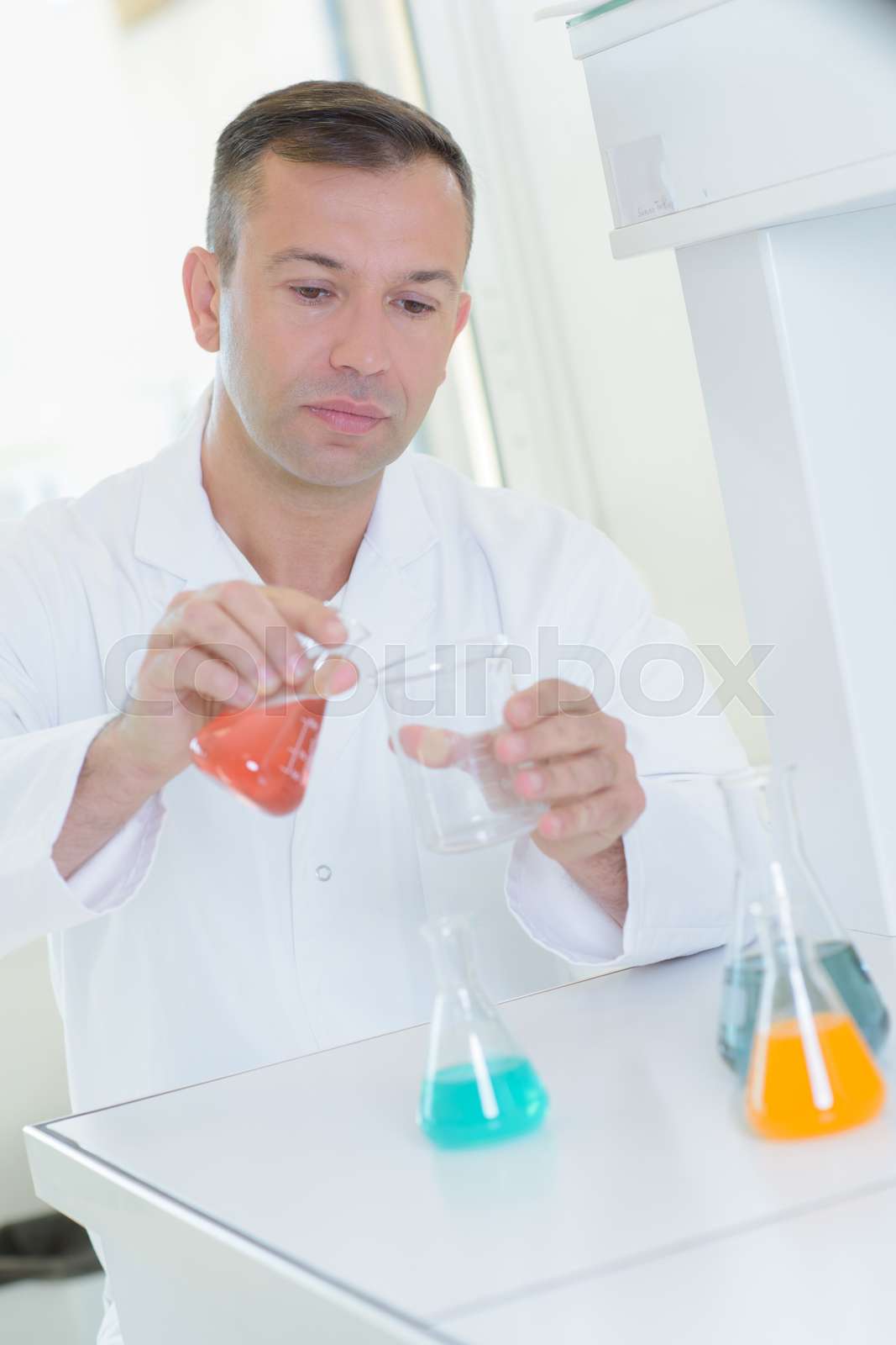 chemist mixing solutions | Stock image | Colourbox
