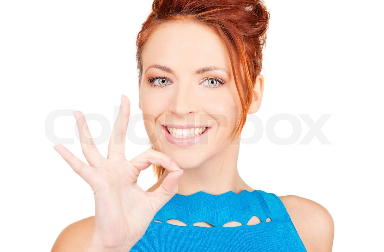 lyse billede af dejlige rødhårede Viser ok tegn | Stock foto | Colourbox