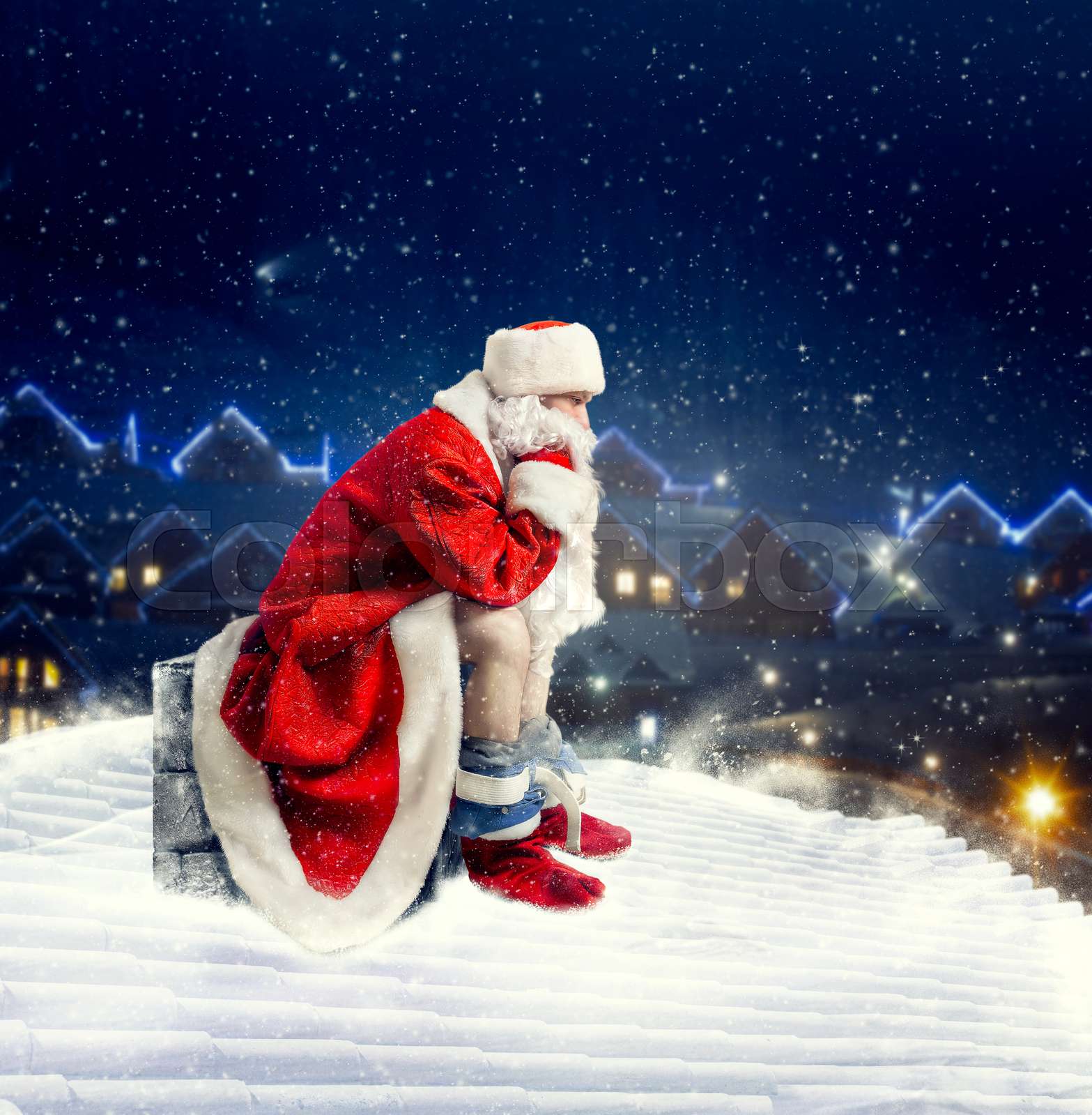 Santa Claus on rooftop shit in the chimney | Stock image | Colourbox