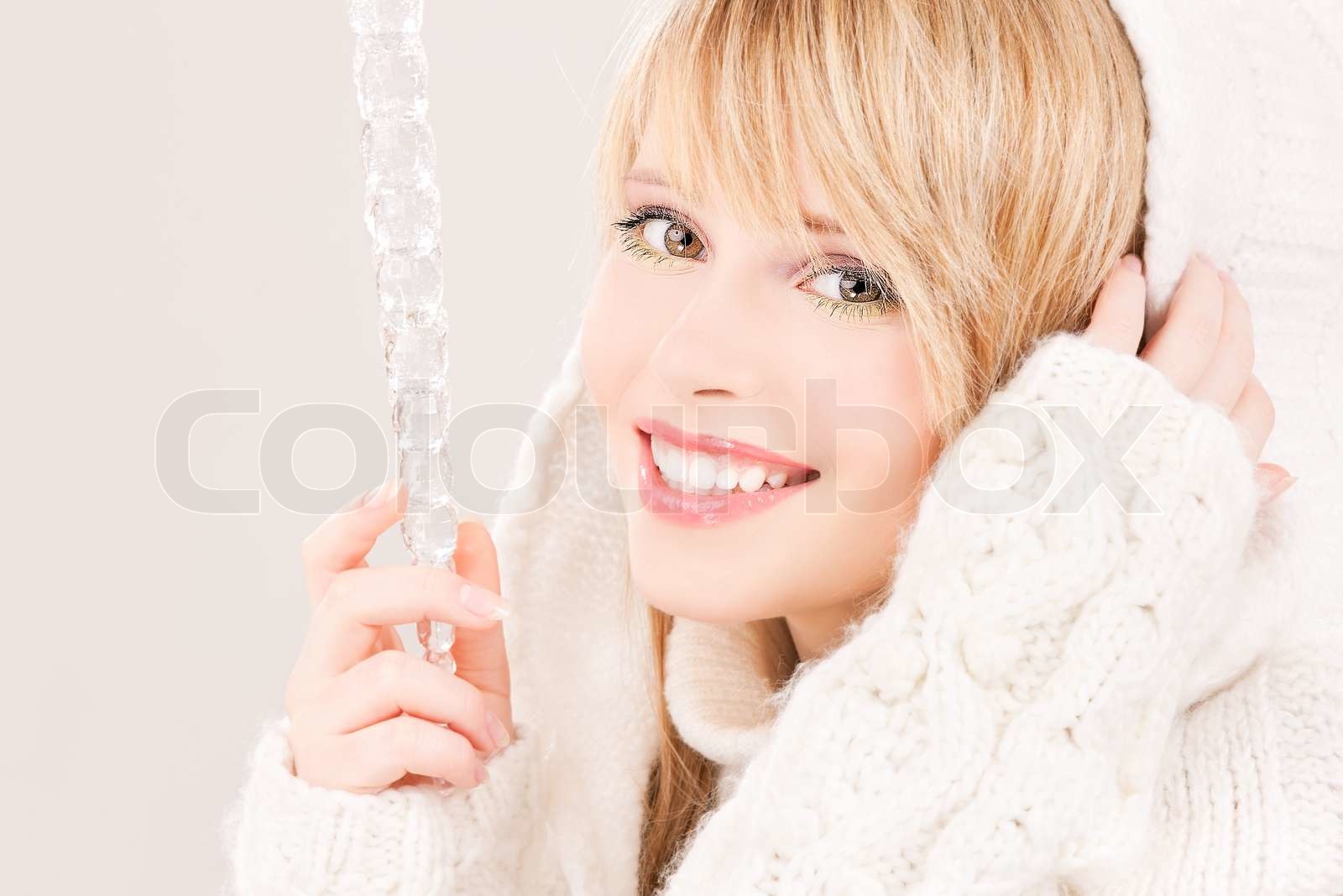 portrait of lovely teenage girl with icicle | Stock image | Colourbox