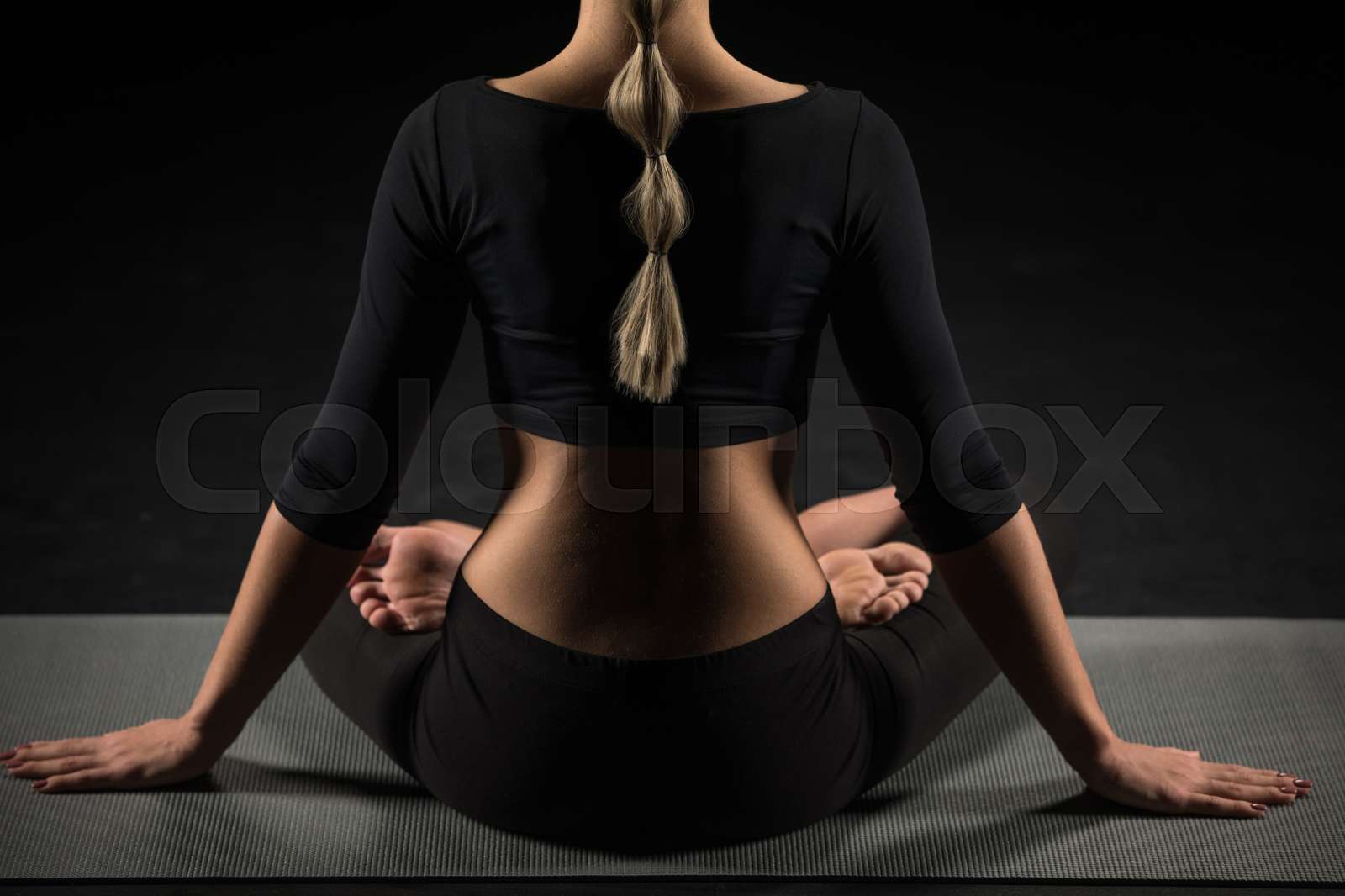 Woman sitting in lotus position | Stock image | Colourbox