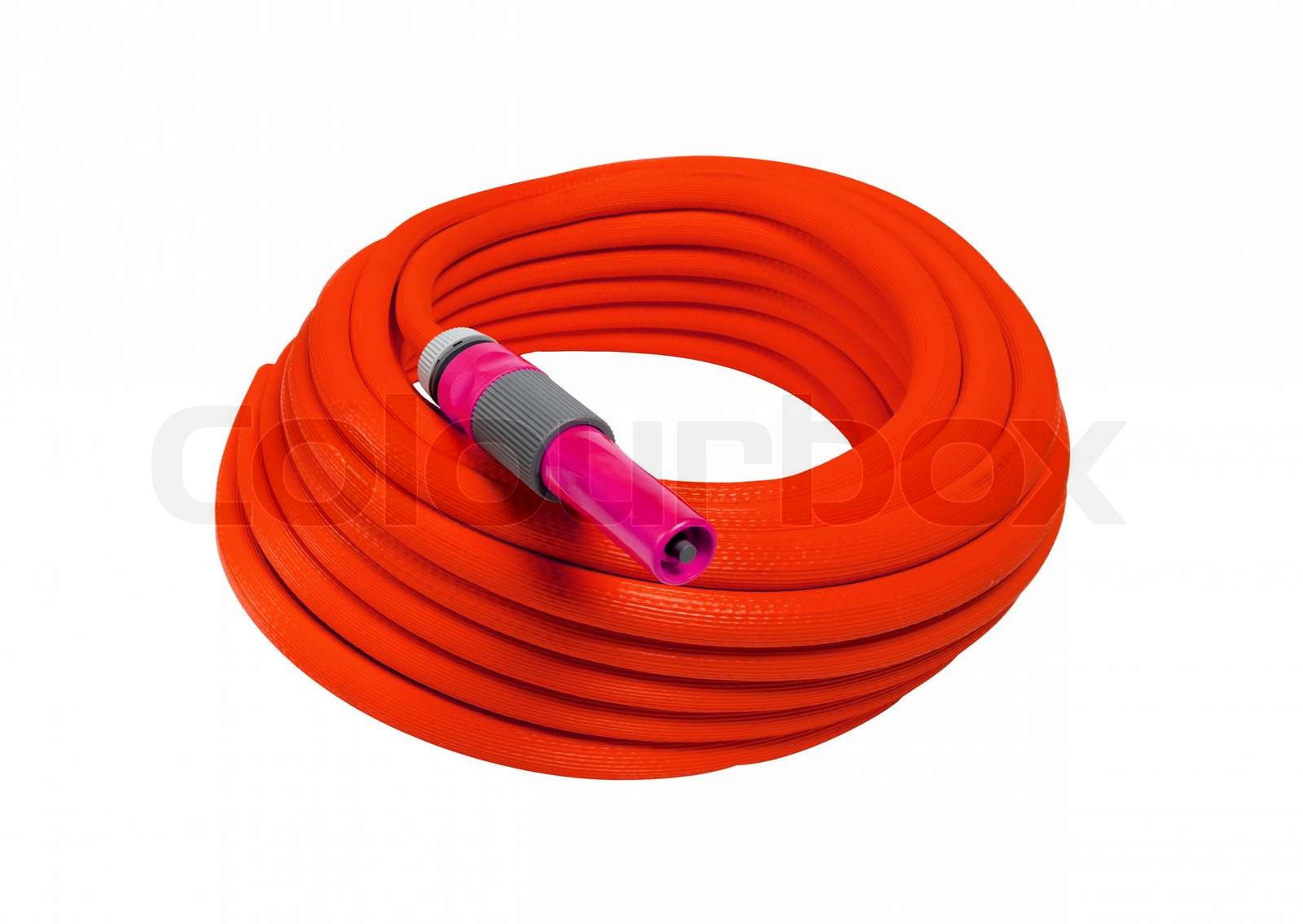 red garden hose with nozzle on white | Stock image | Colourbox