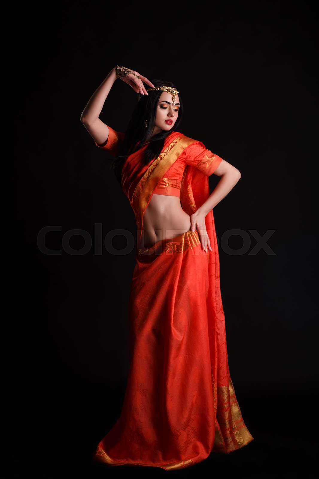 Full body traditional Indian girl in red sari black background. | Stock ...