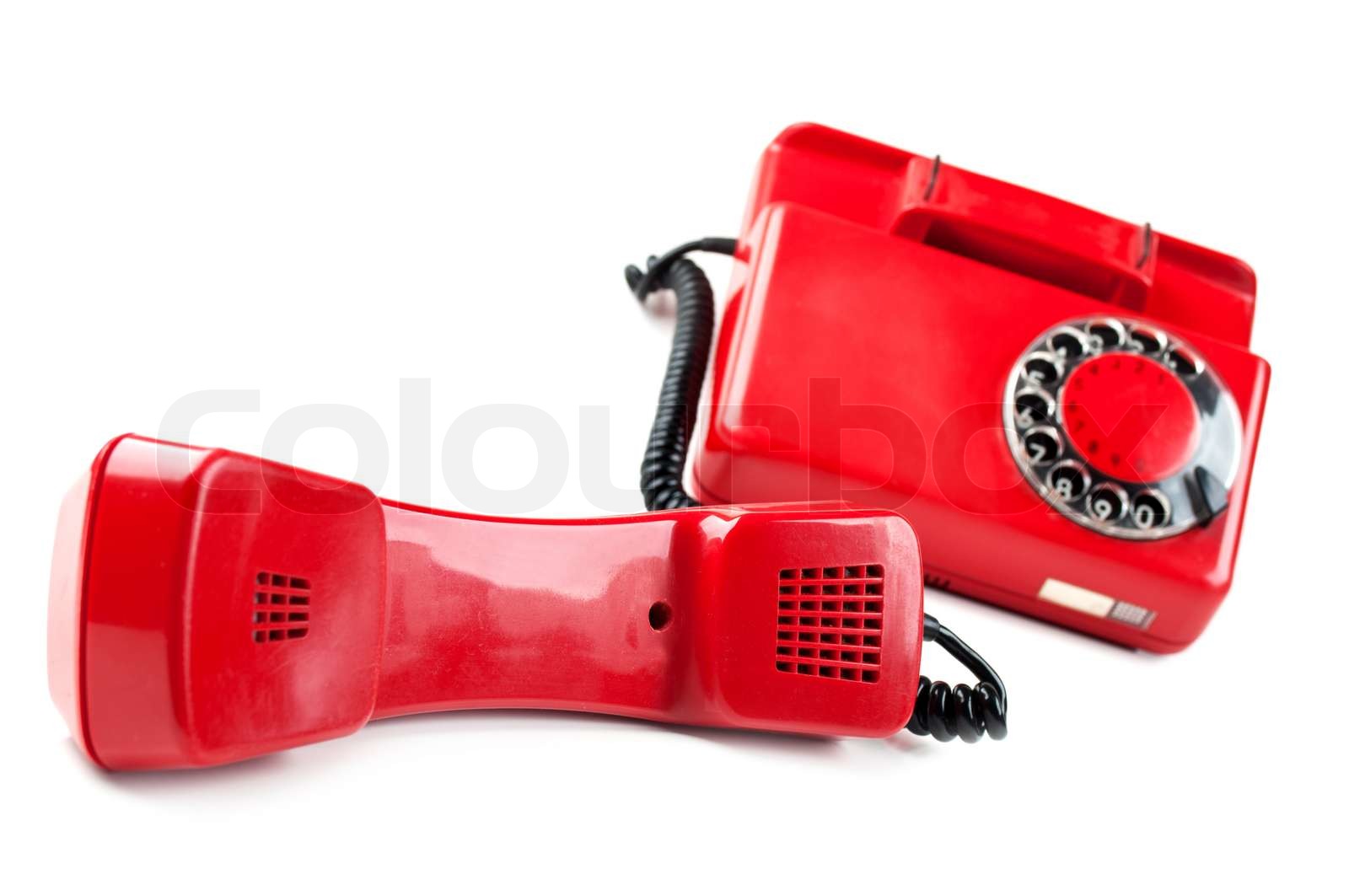 alt und rotes Telefon auf einem weißen Hintergrund | Stock Bild | Colourbox