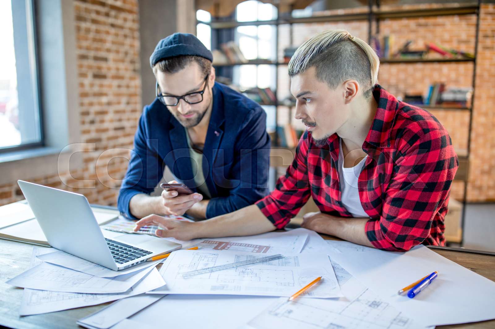 Architects using laptop and smartphone | Stock image | Colourbox