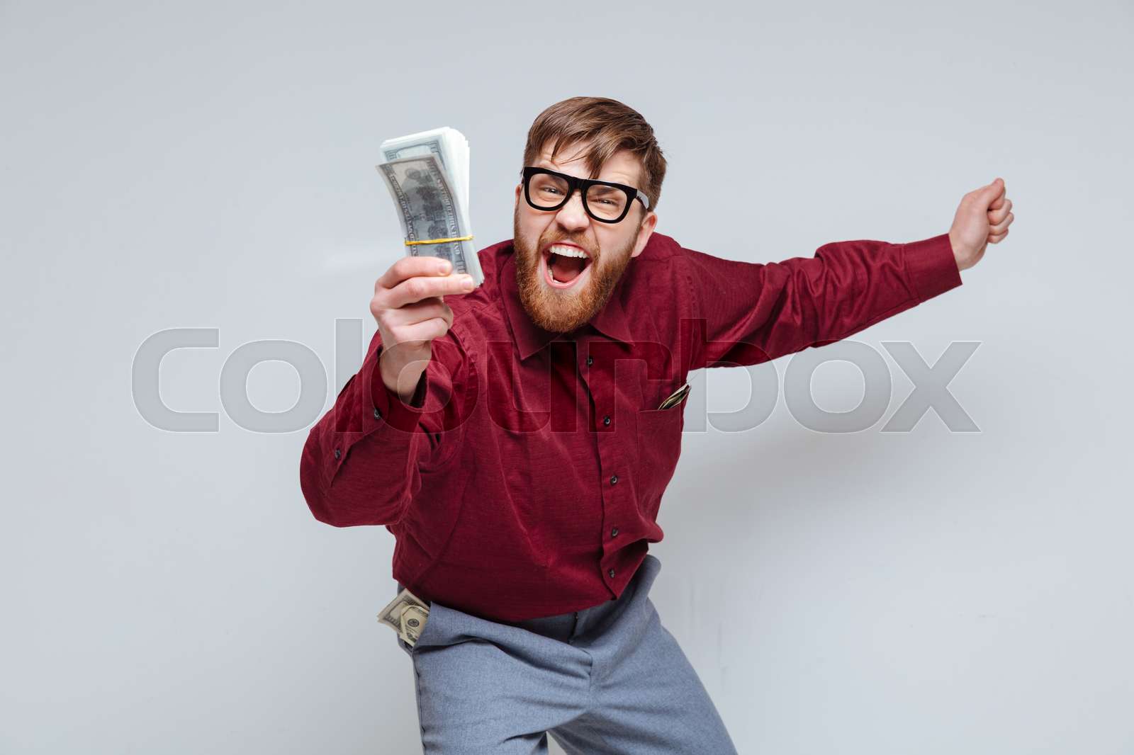 So Happy Male nerd with money in hand | Stock image | Colourbox