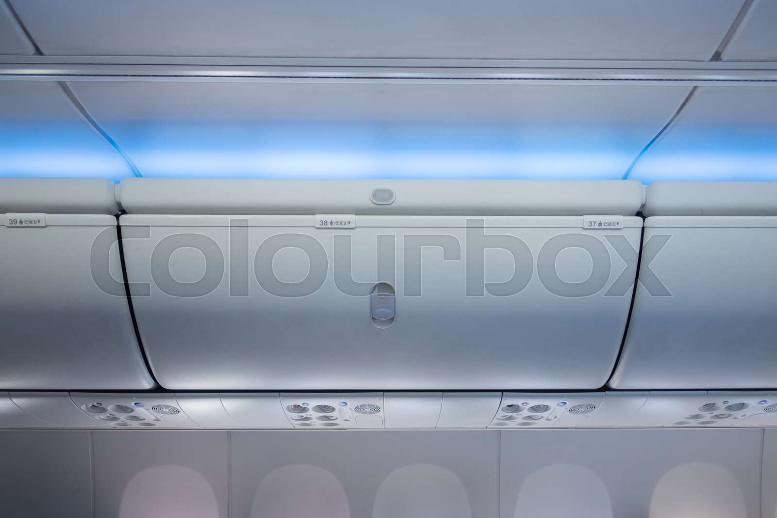 Overhead locker in airplane | Stock image | Colourbox