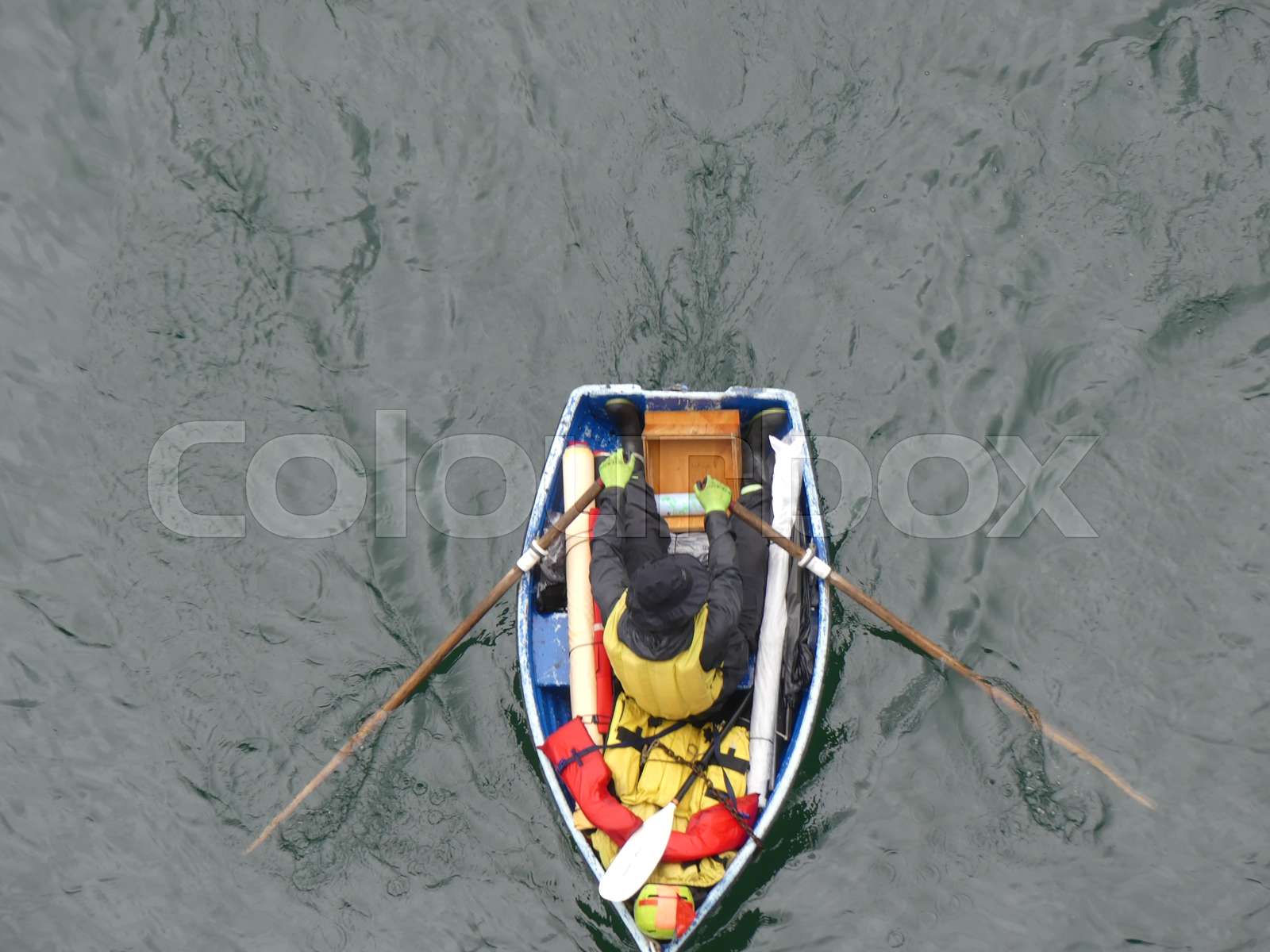 Man sitting rowboat top view | Stock image | Colourbox