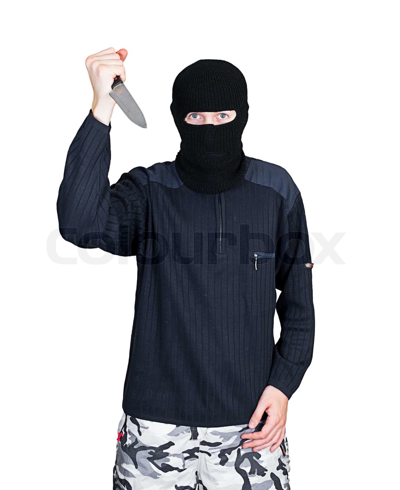 Bandit in black mask with knife | Stock image | Colourbox