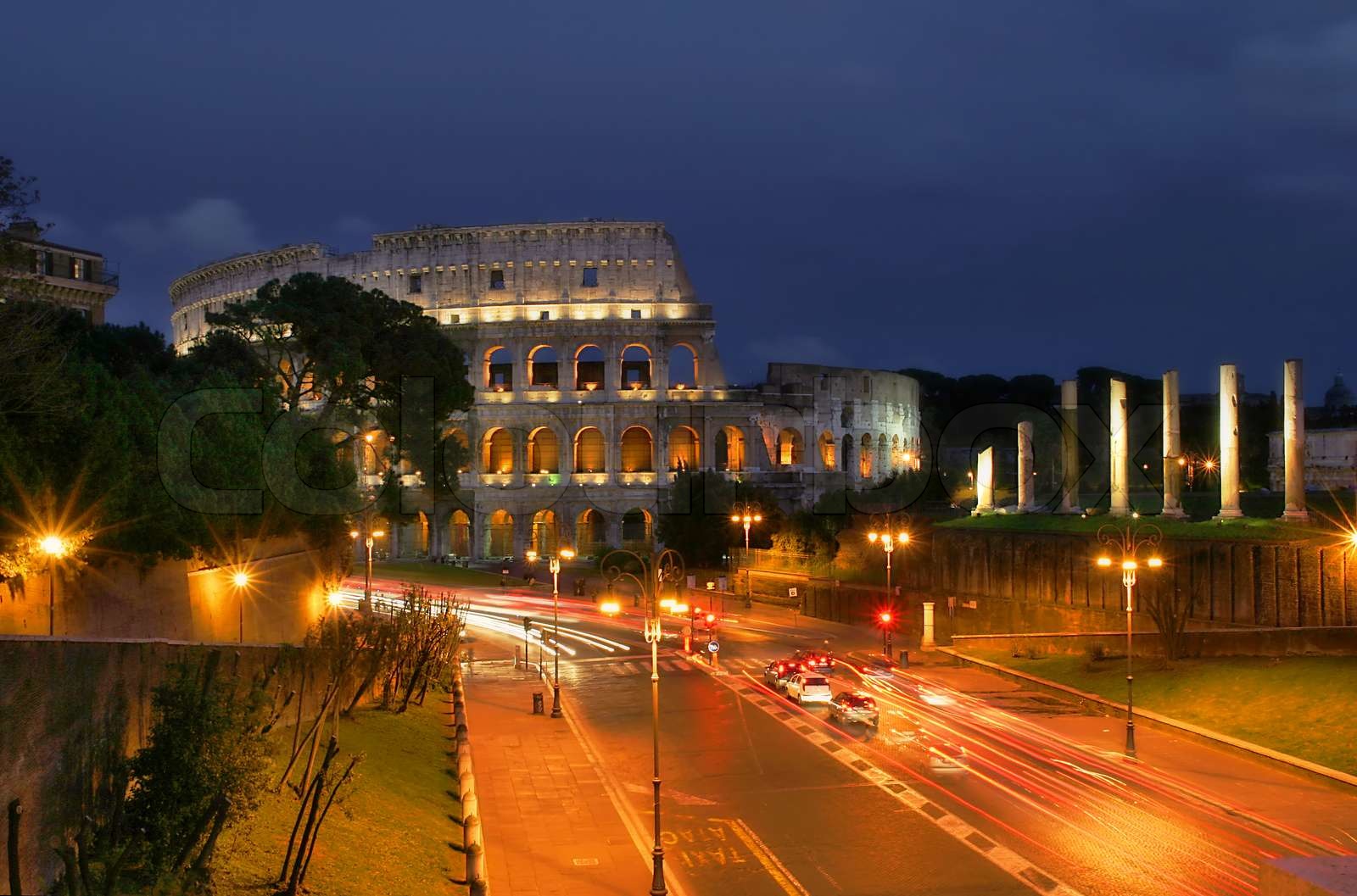 Famous roman Coliseum and illuminated streets of Rome at night | Stock ...