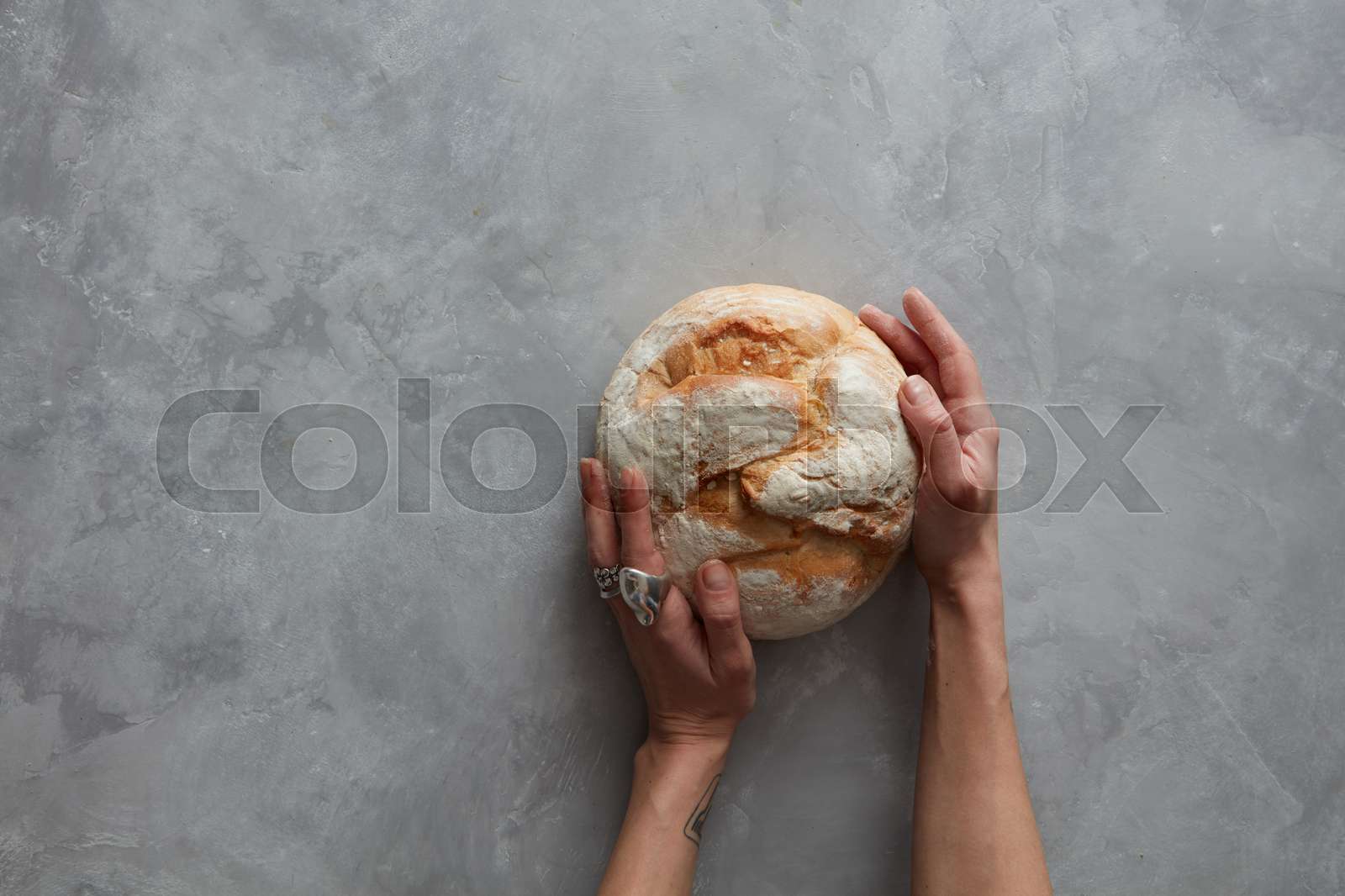 man holding tasty fresh bread, | Stock image | Colourbox