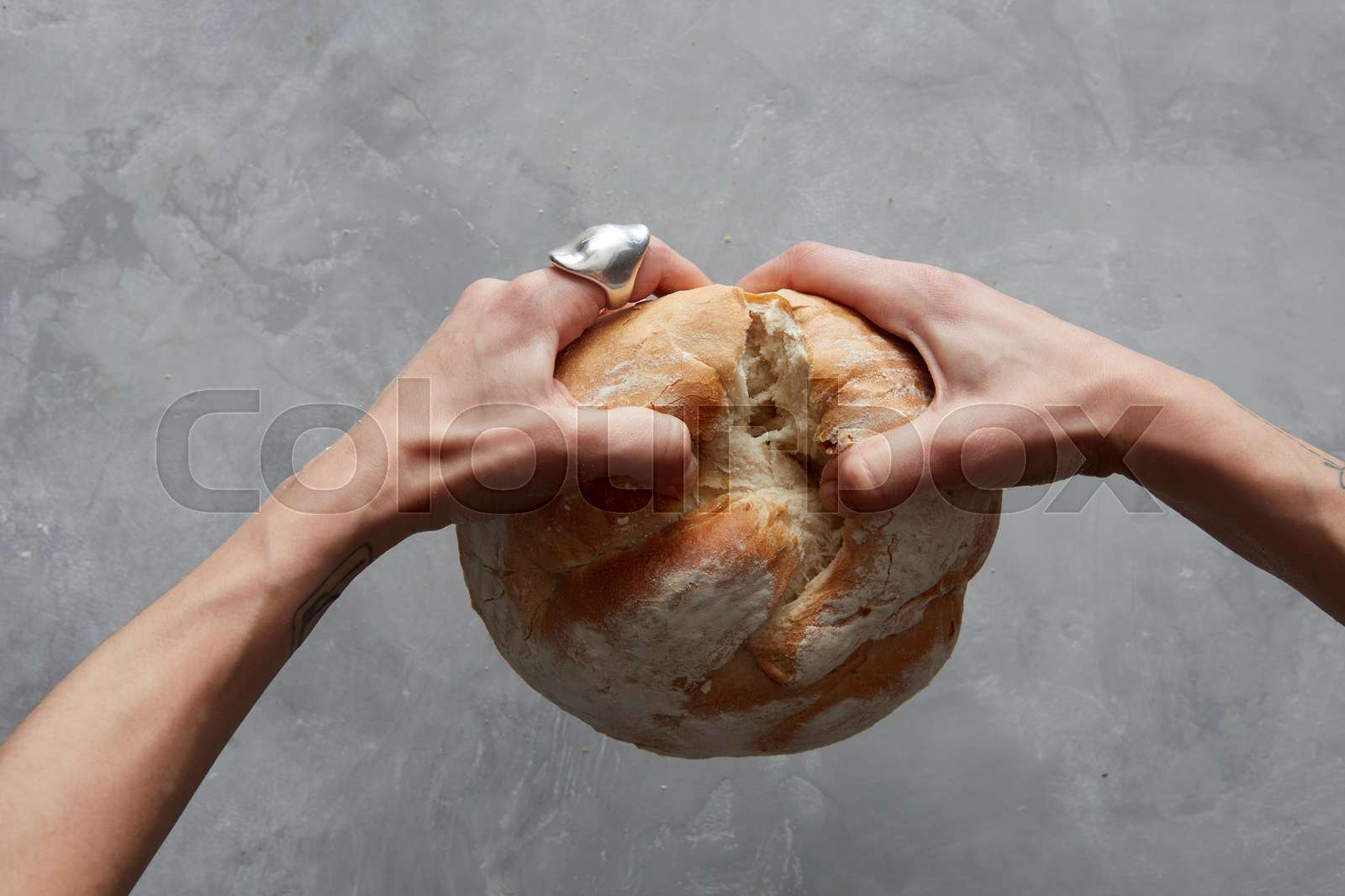hand breaking Bread | Stock image | Colourbox