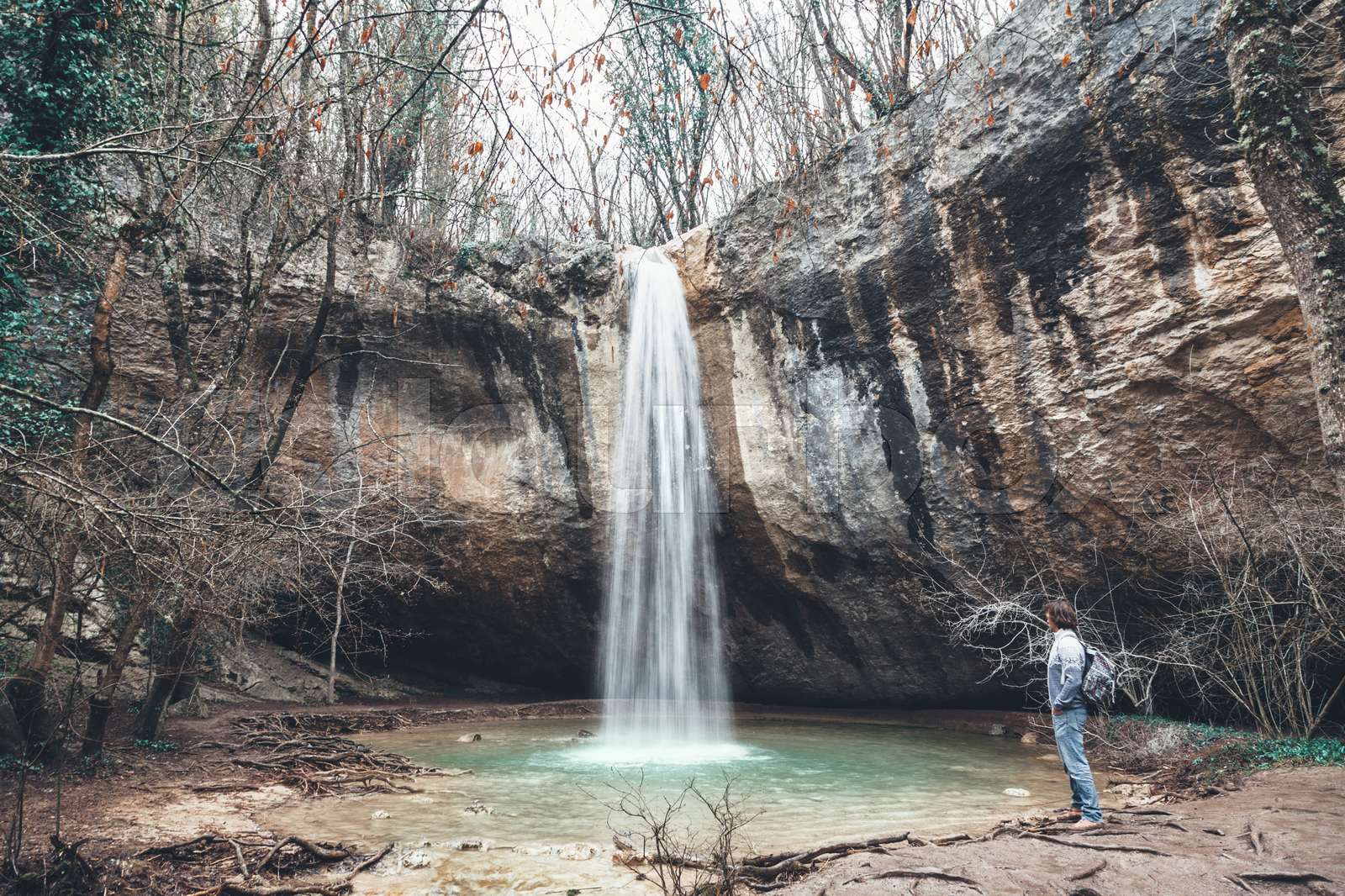 Human standing by the waterfall | Stock image | Colourbox