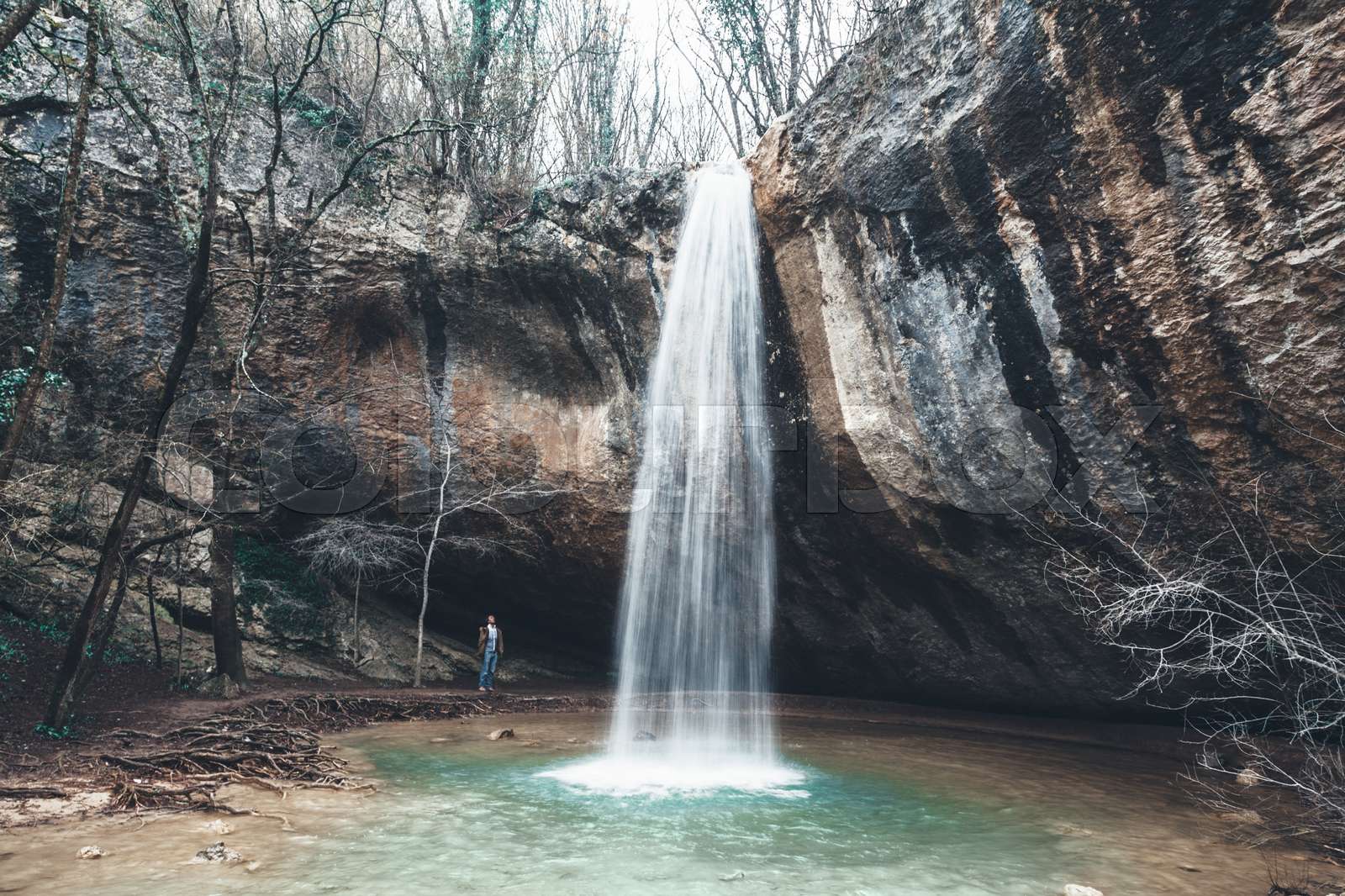 Human standing by the waterfall | Stock image | Colourbox