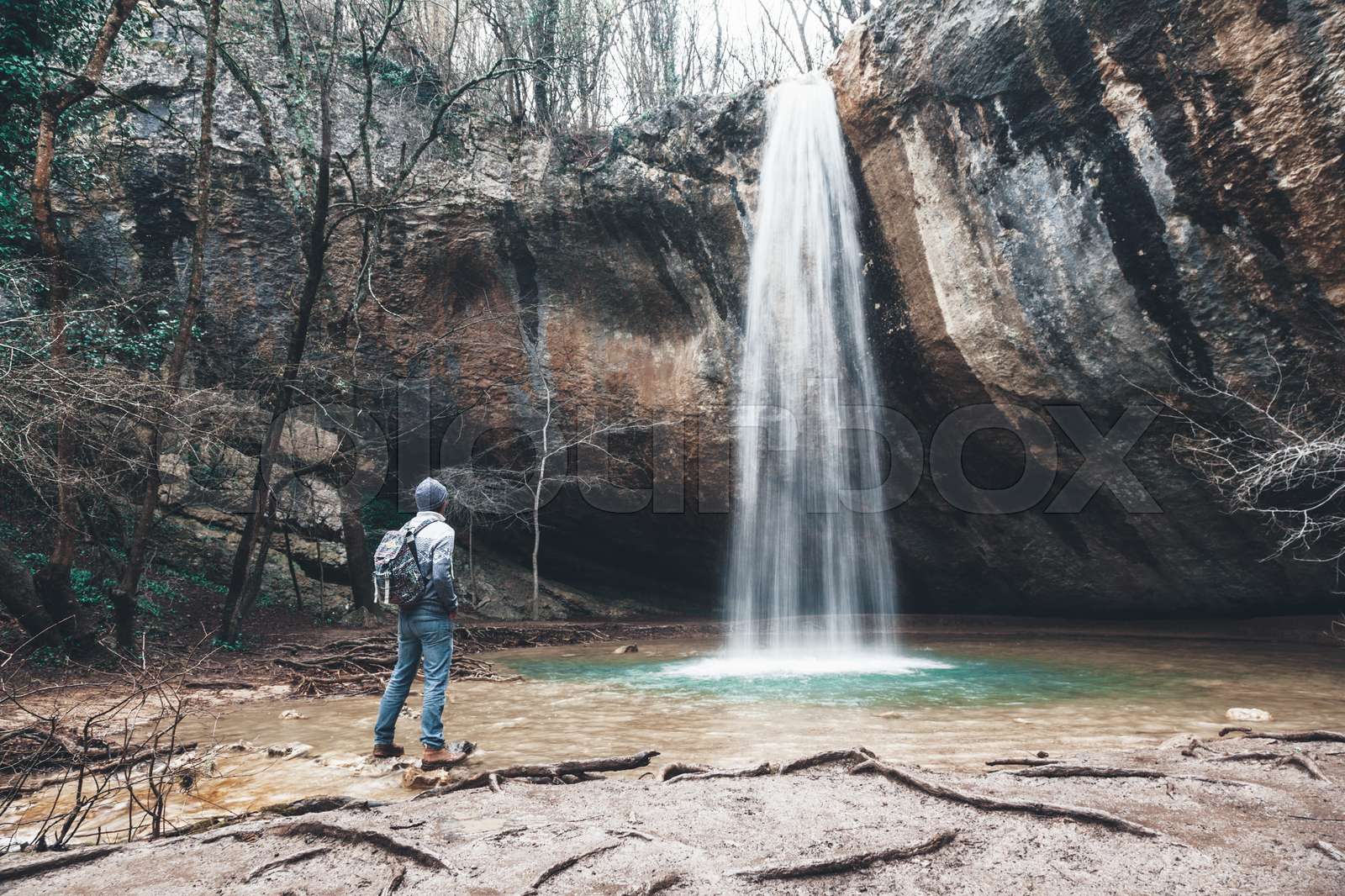 Human standing by the waterfall | Stock image | Colourbox