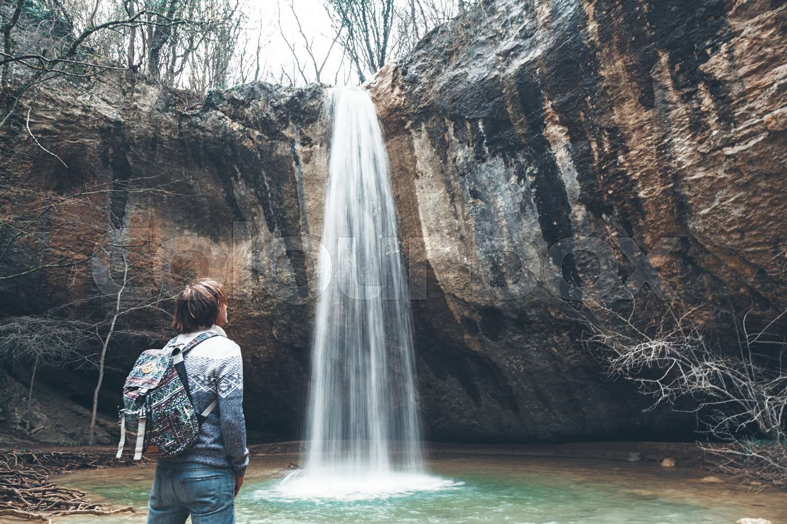 Human standing by the waterfall | Stock image | Colourbox