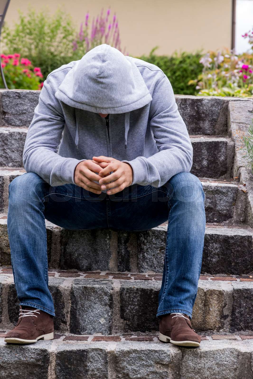 man sitting on steps | Stock image | Colourbox