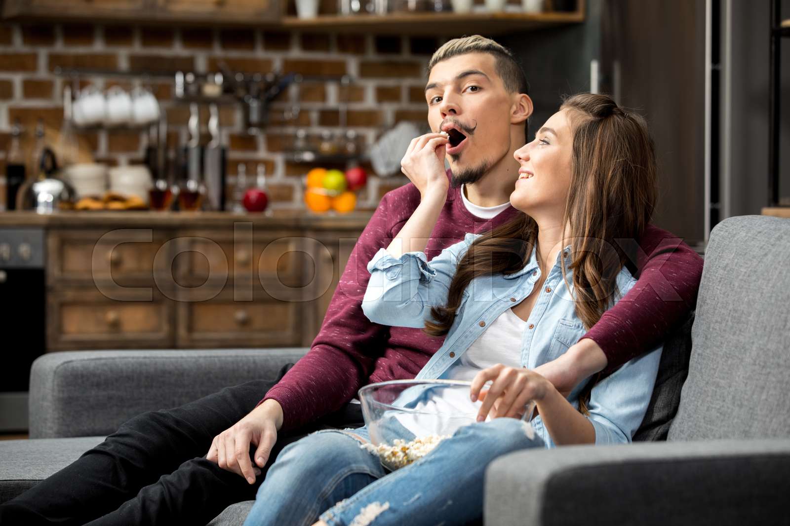 Couple eating popcorn | Stock image | Colourbox