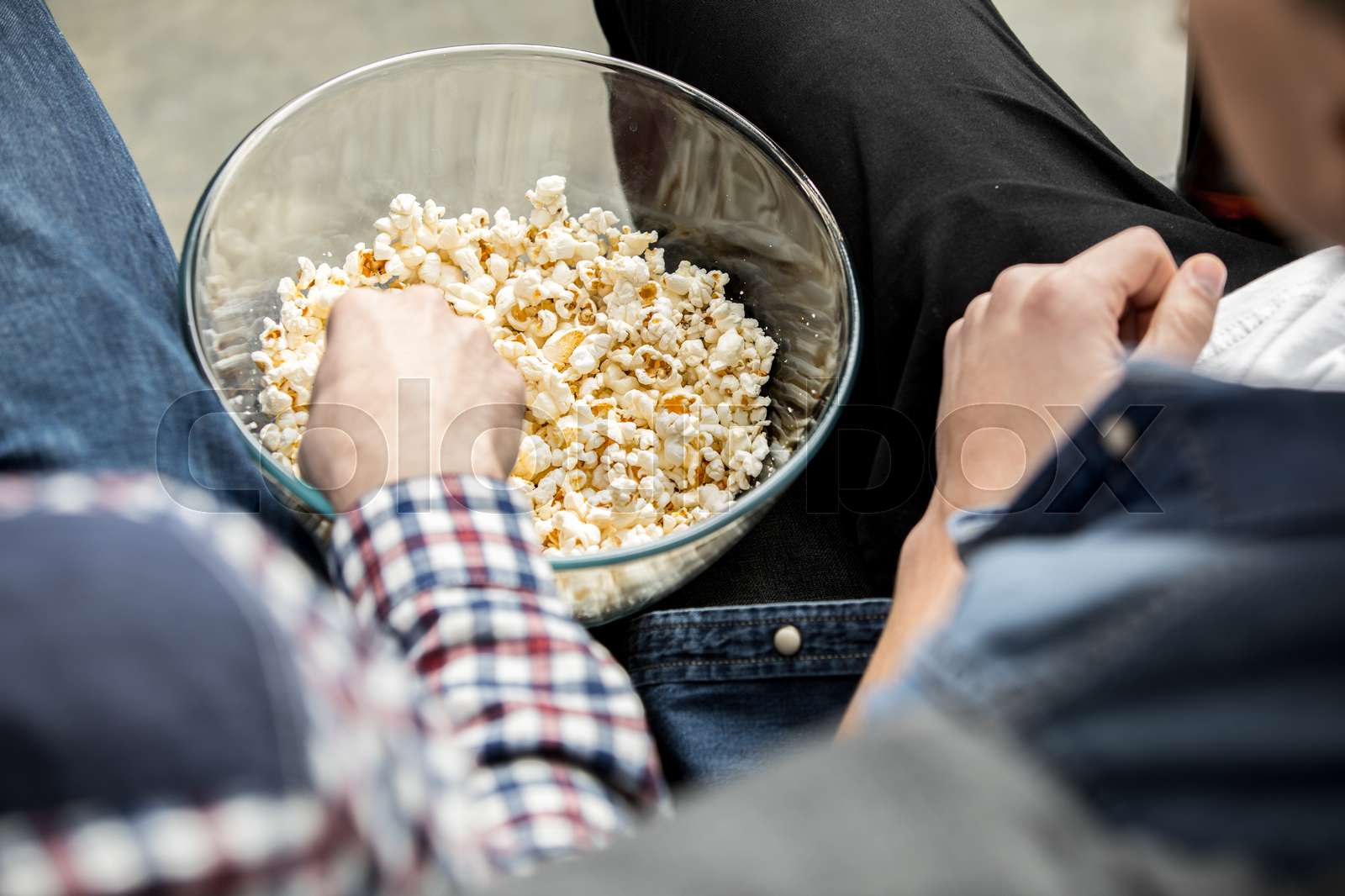Friends eating popcorn | Stock image | Colourbox